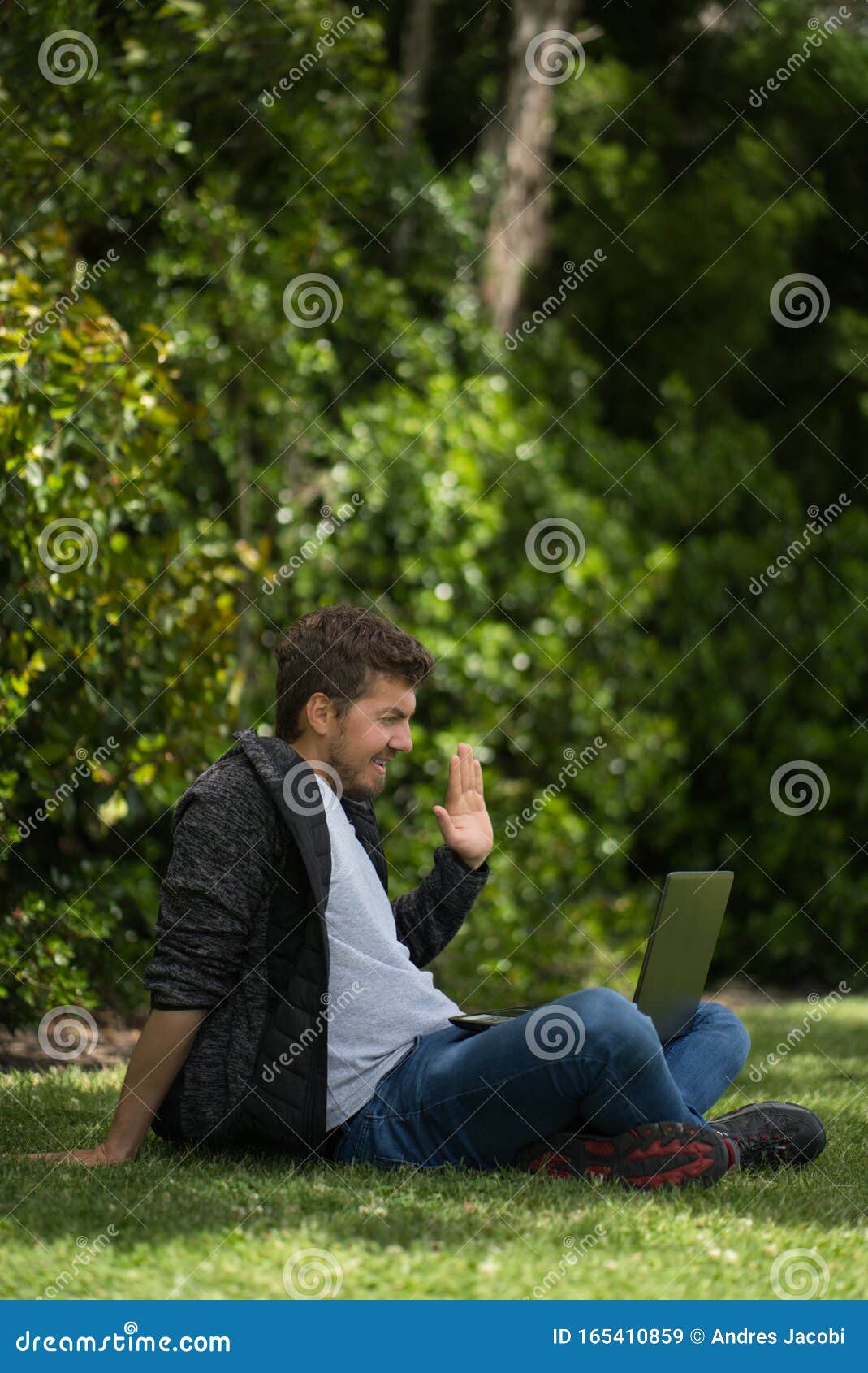Man Having a Video Call with His Computer Saying Hello through the ...