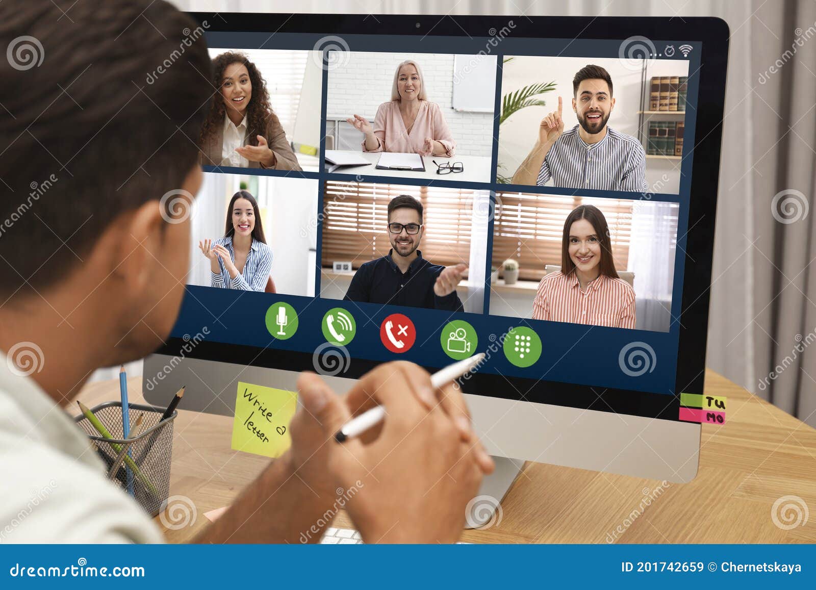 Man Having Video Chat with Colleagues at Table in Office, Closeup. Team ...