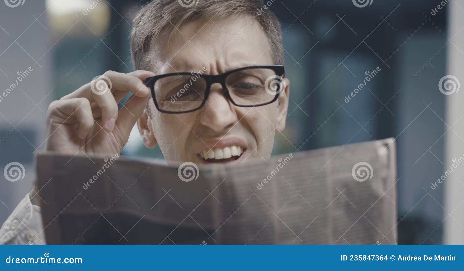 Man Having a Vision Problem while Reading a Newspaper Stock Photo ...