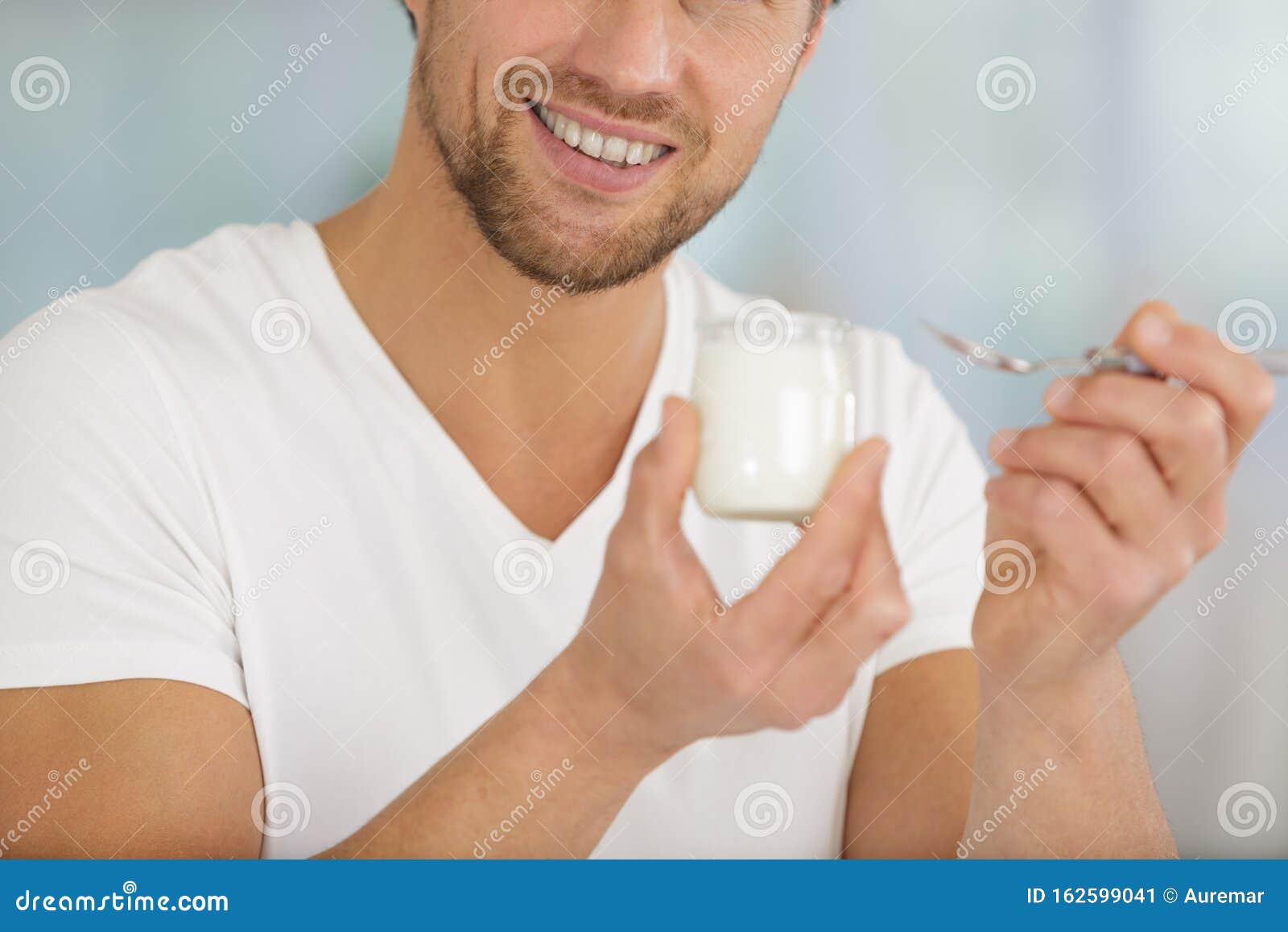 Man having a yogurt stock image. Image of healthy, happy - 162599041