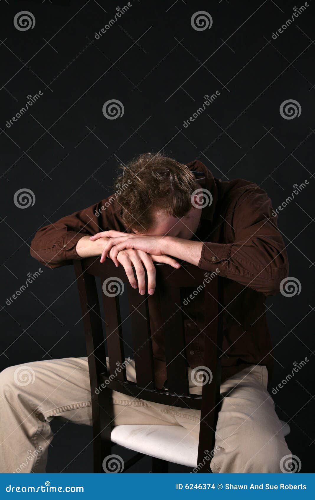 Man with head down stock photo. Image of hide, hair, chair - 6246374