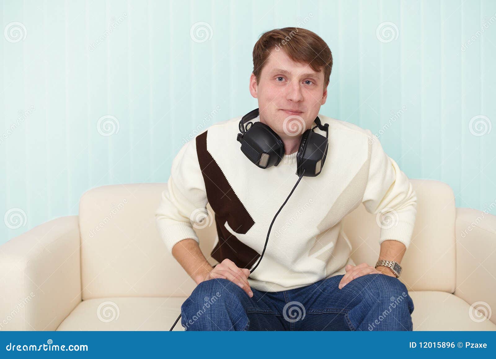 Man with Head-phones on Sofa Stock Photo - Image of human, blue: 12015896