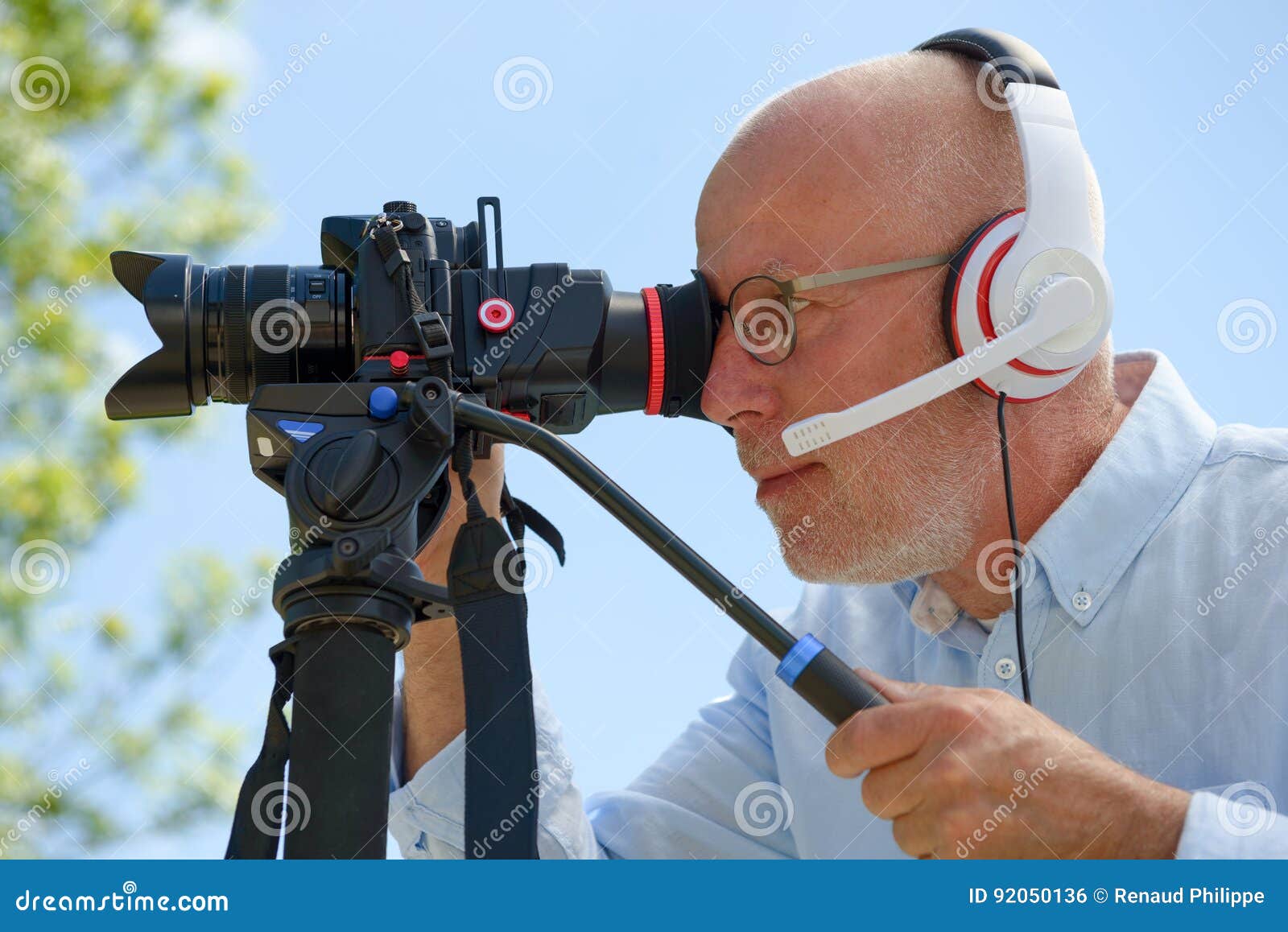 Man with Headphones, Using a Camera Dslr Stock Photo - Image of ...