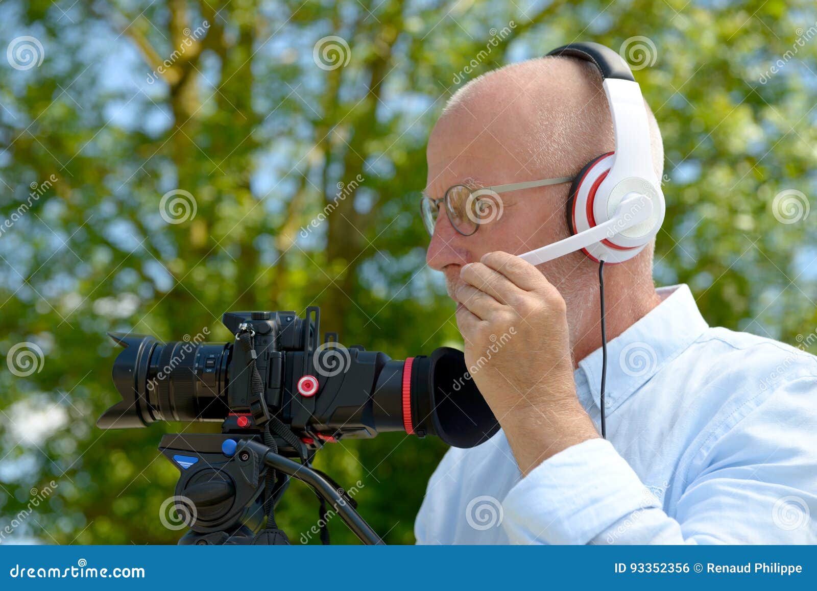 Man with Headphones, Using a Camera Dslr Stock Photo - Image of taking ...