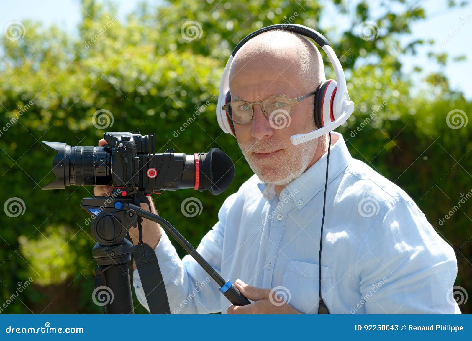 Man with Headphones, Using a Camera Dslr Stock Image - Image of ...