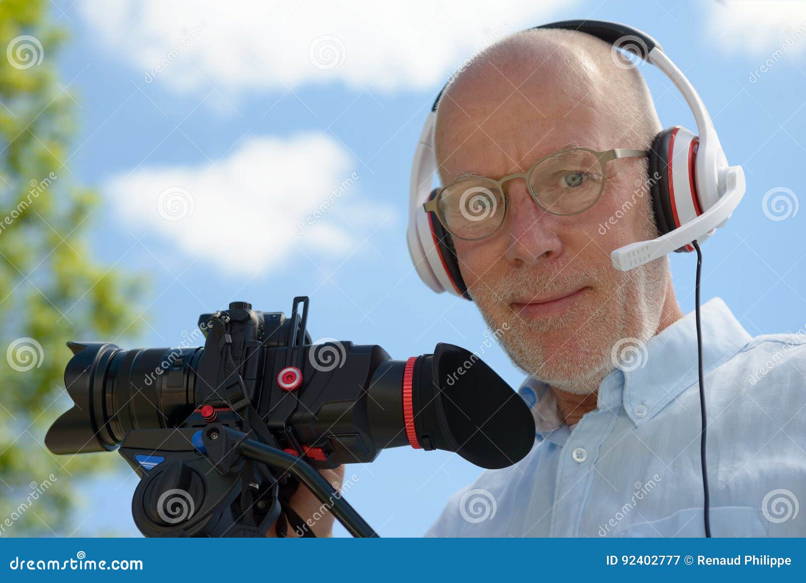 Man with Headphones, Using a Camera Dslr Stock Image - Image of film ...