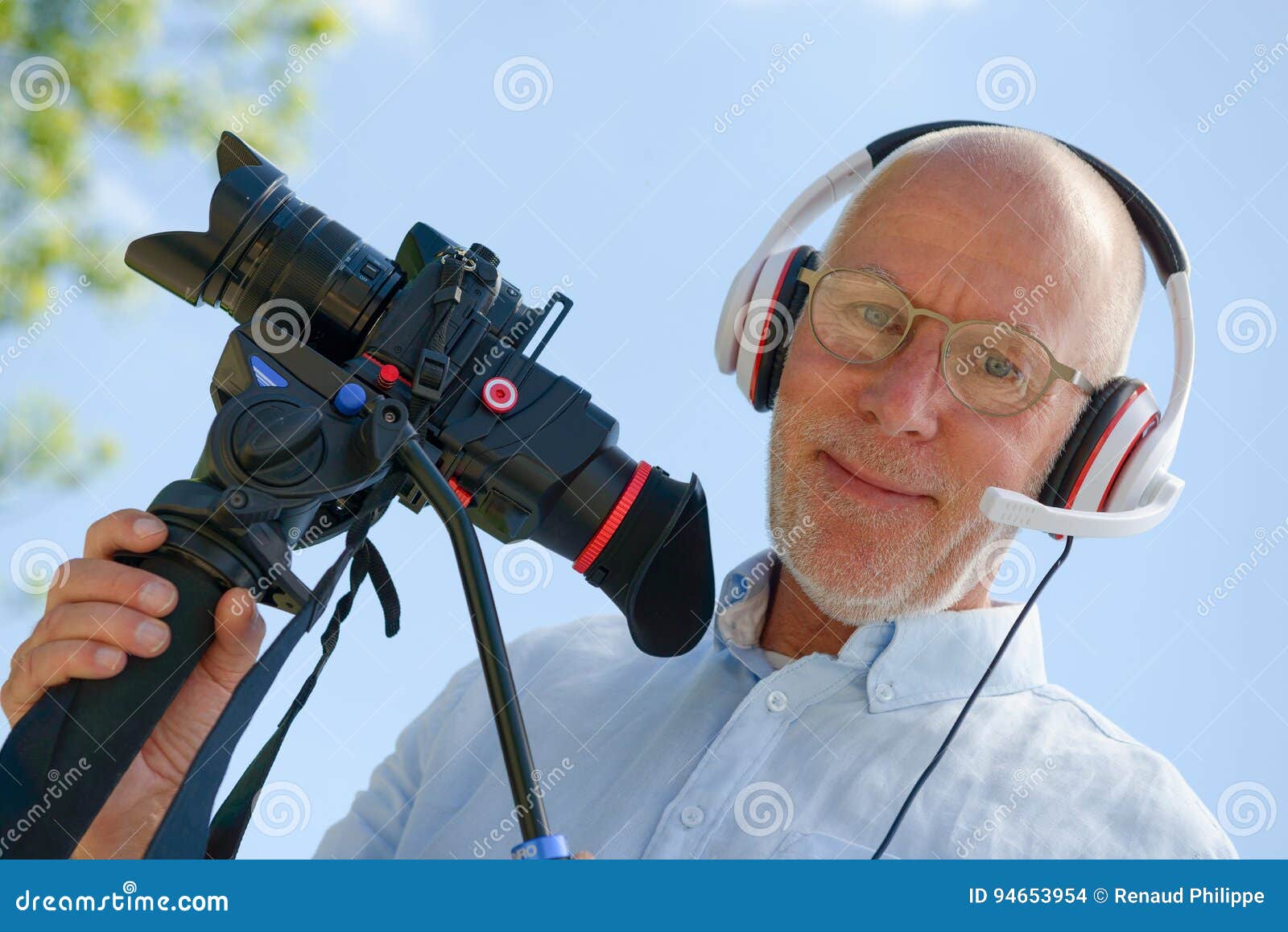 Man with Headphones, Using a Camera Dslr Stock Photo - Image of film ...