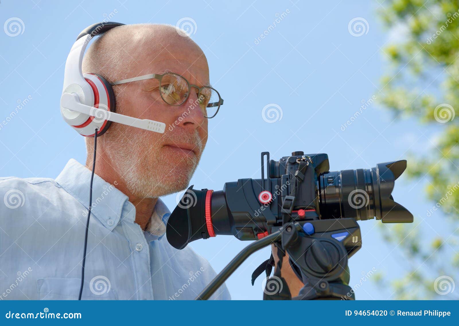 Man with Headphones, Using a Camera Dslr Stock Photo - Image of ...