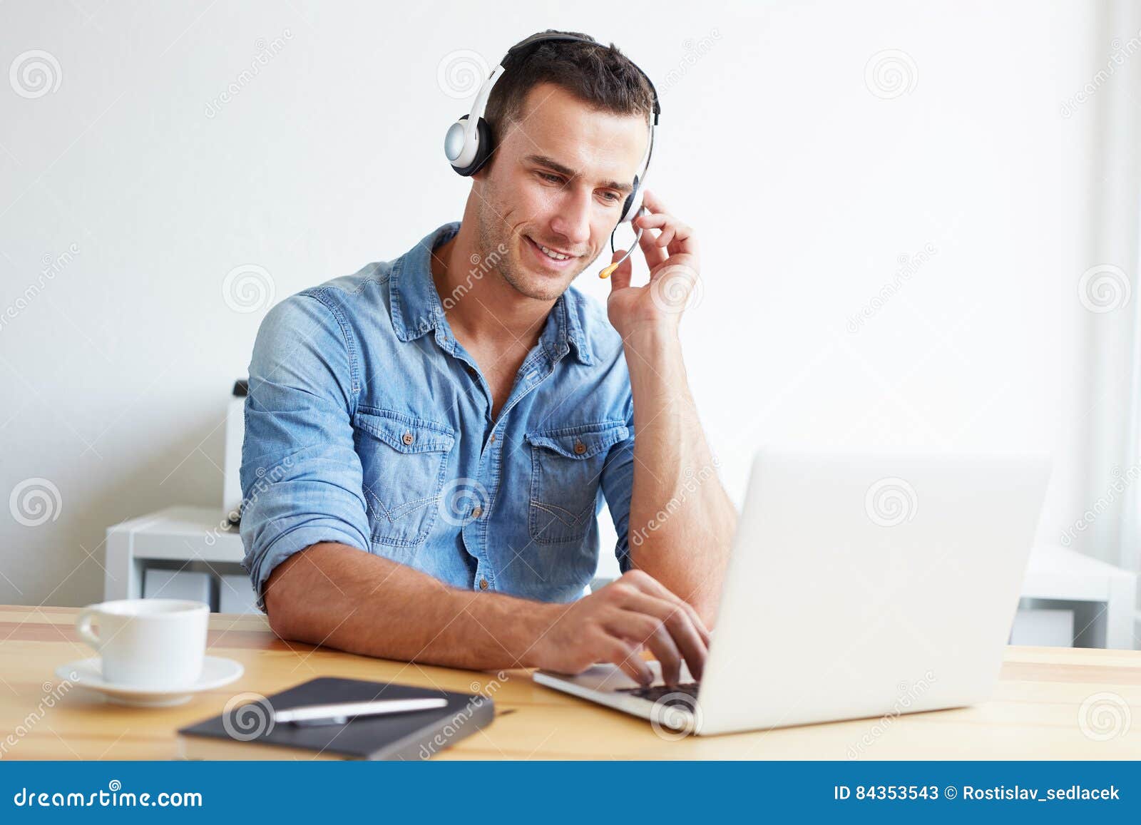 Man with a Headset Sitting in Call Center Stock Image - Image of laptop ...