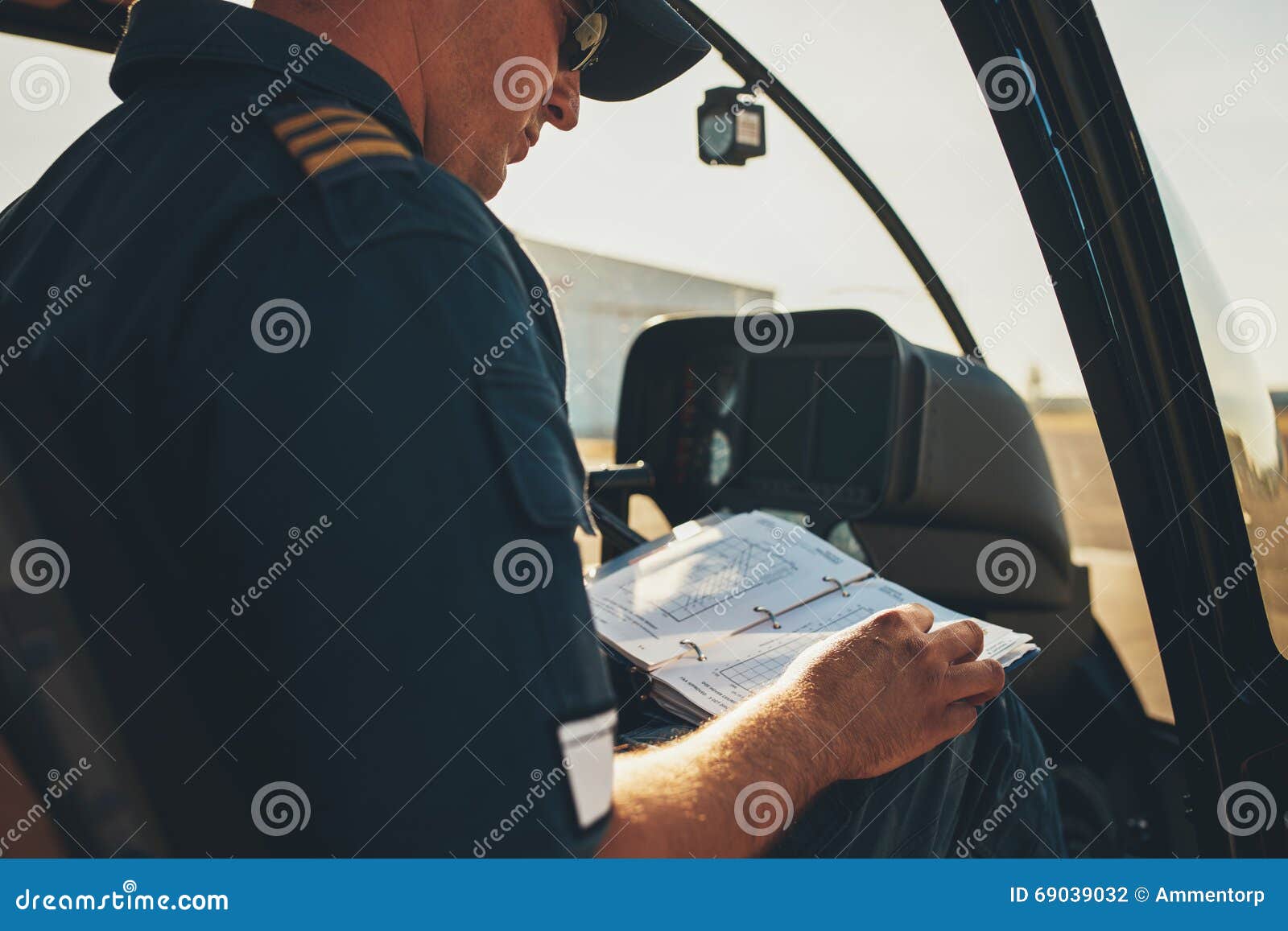 Man Helicopter Pilot Reading a Manual Booklet Stock Photo - Image of ...
