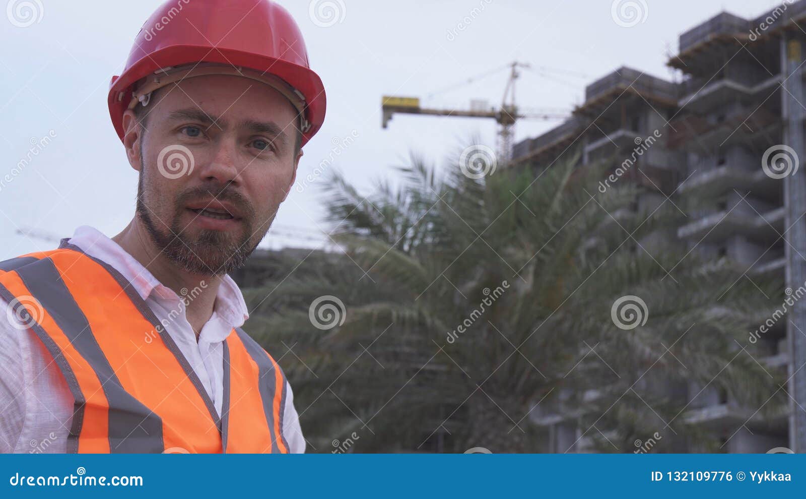 Man in a Helmet, Architect, Engineer, Manager Tells about the Progress ...