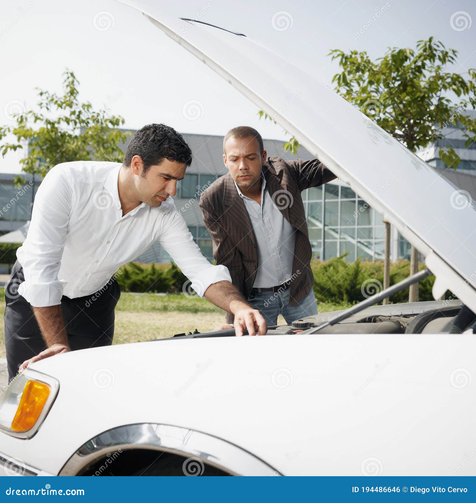Man Helping Driver with Car Problem and Engine Breakdown Stock Photo ...