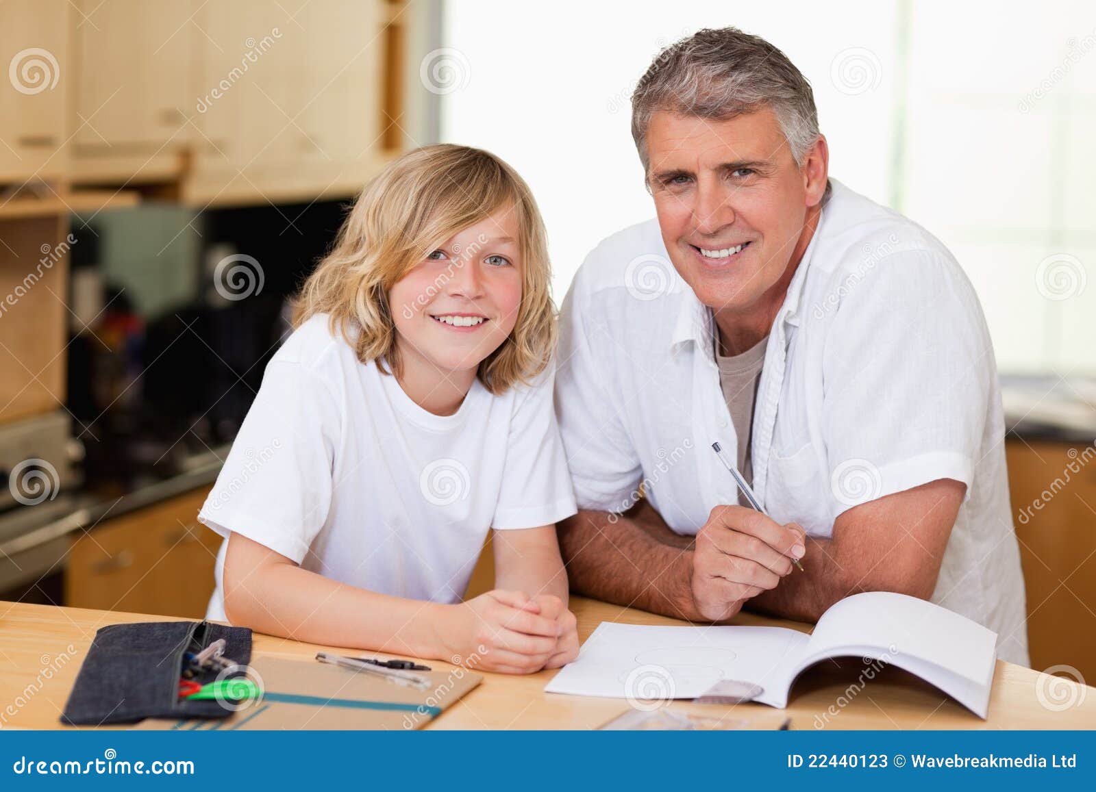 Man Helping His Son with Homework Stock Image - Image of people ...