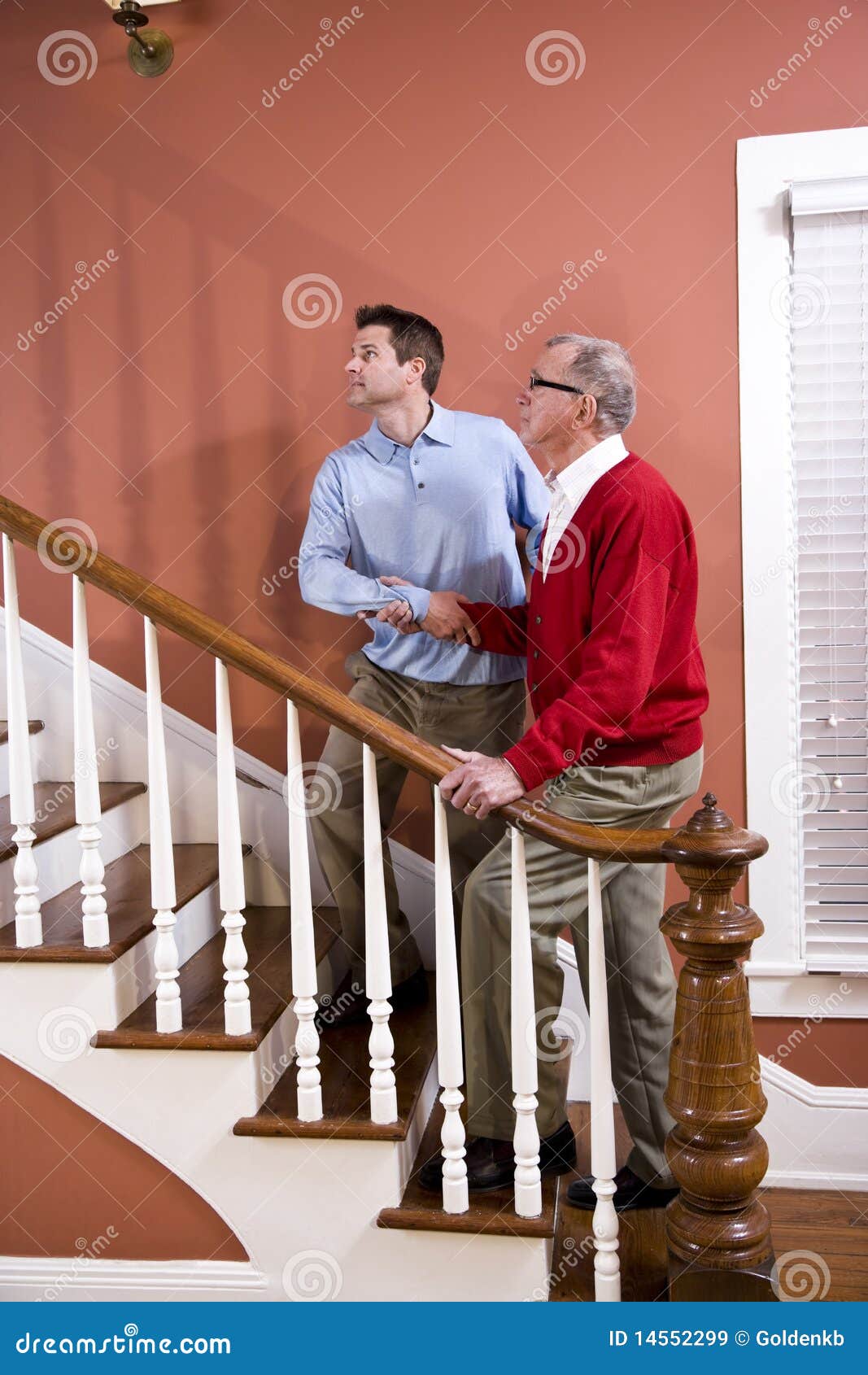 Man Helping Senior Father Climb Stairs at Home Stock Image - Image of ...