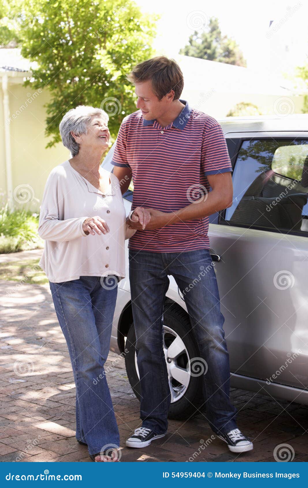 Man Helping Senior Woman into Car Stock Photo - Image of helping, adult ...