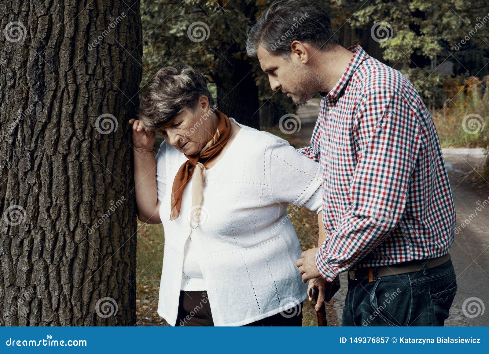 Man Helping Weak Elderly Woman with Breathlessness Attack during Walk ...