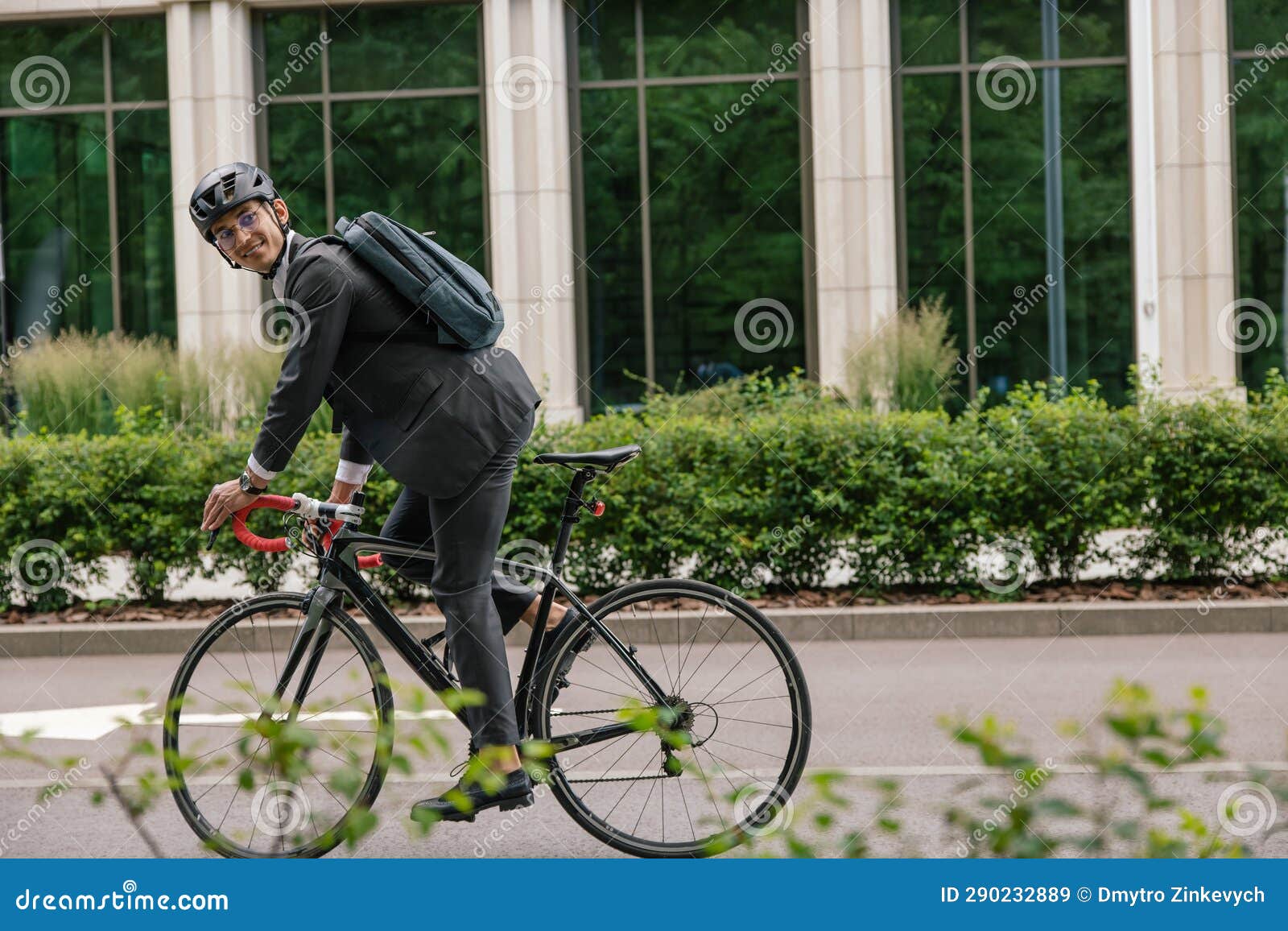 Man in Hemlet and with a Backpack Riding a Bike Stock Image - Image of ...