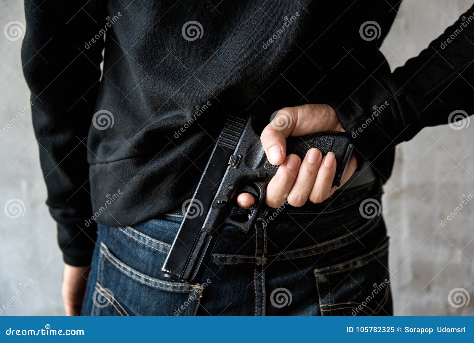 Man Hid Gun Behind Their Back Stock Image - Image of jeans, back: 105782325