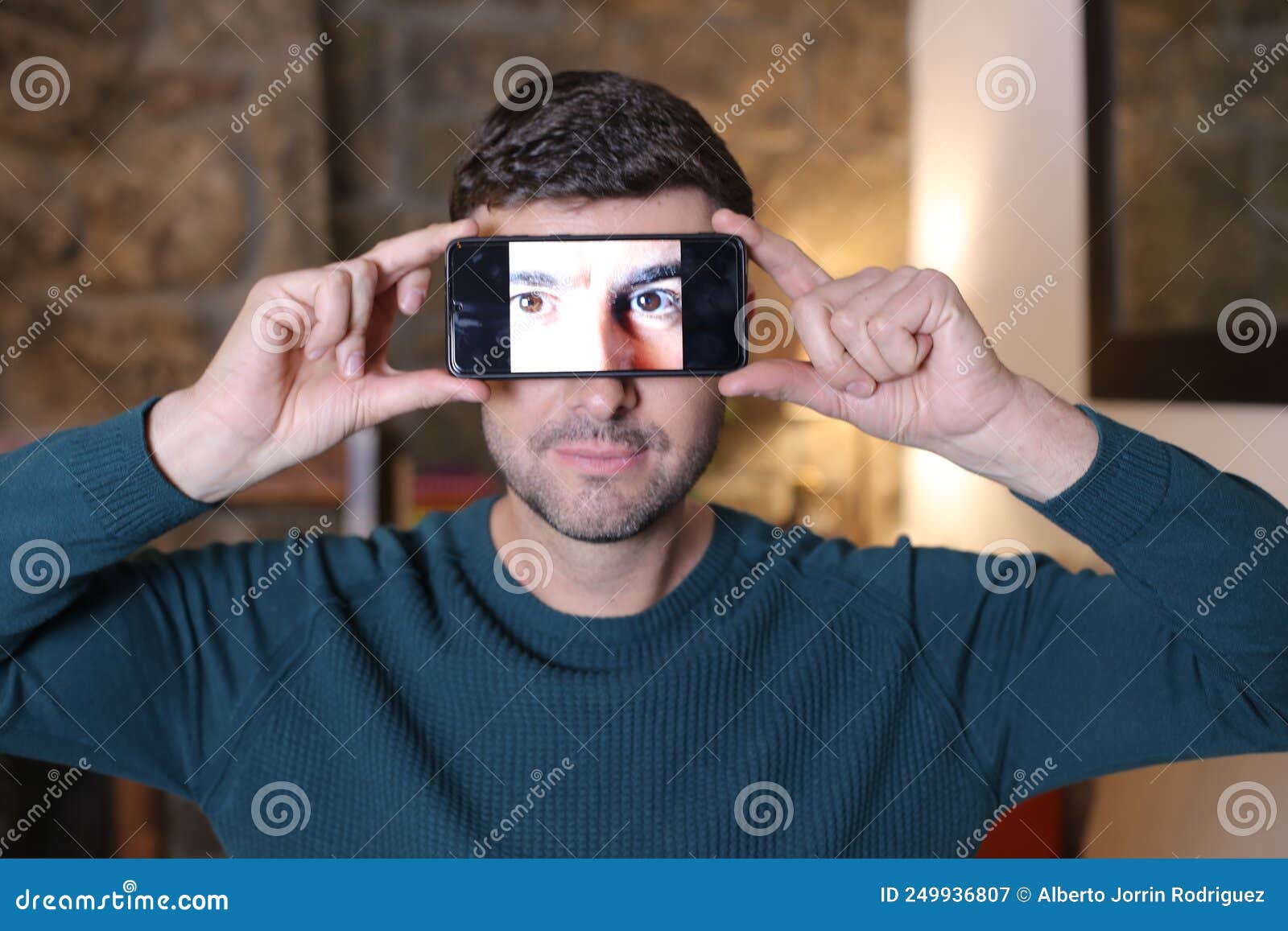 Man Hiding Behind Mobile Phone Stock Image - Image of face, photograph ...