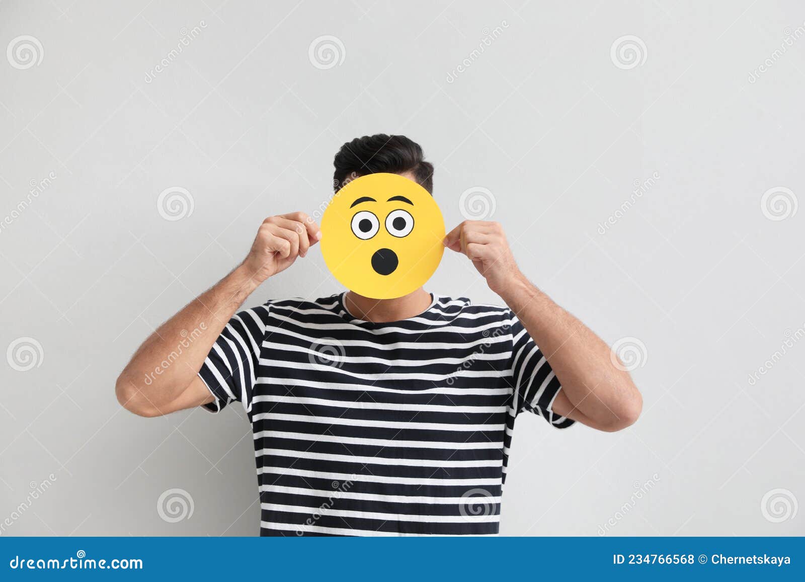 Man Hiding Emotions Using Card with Drawn Surprised Face on White ...