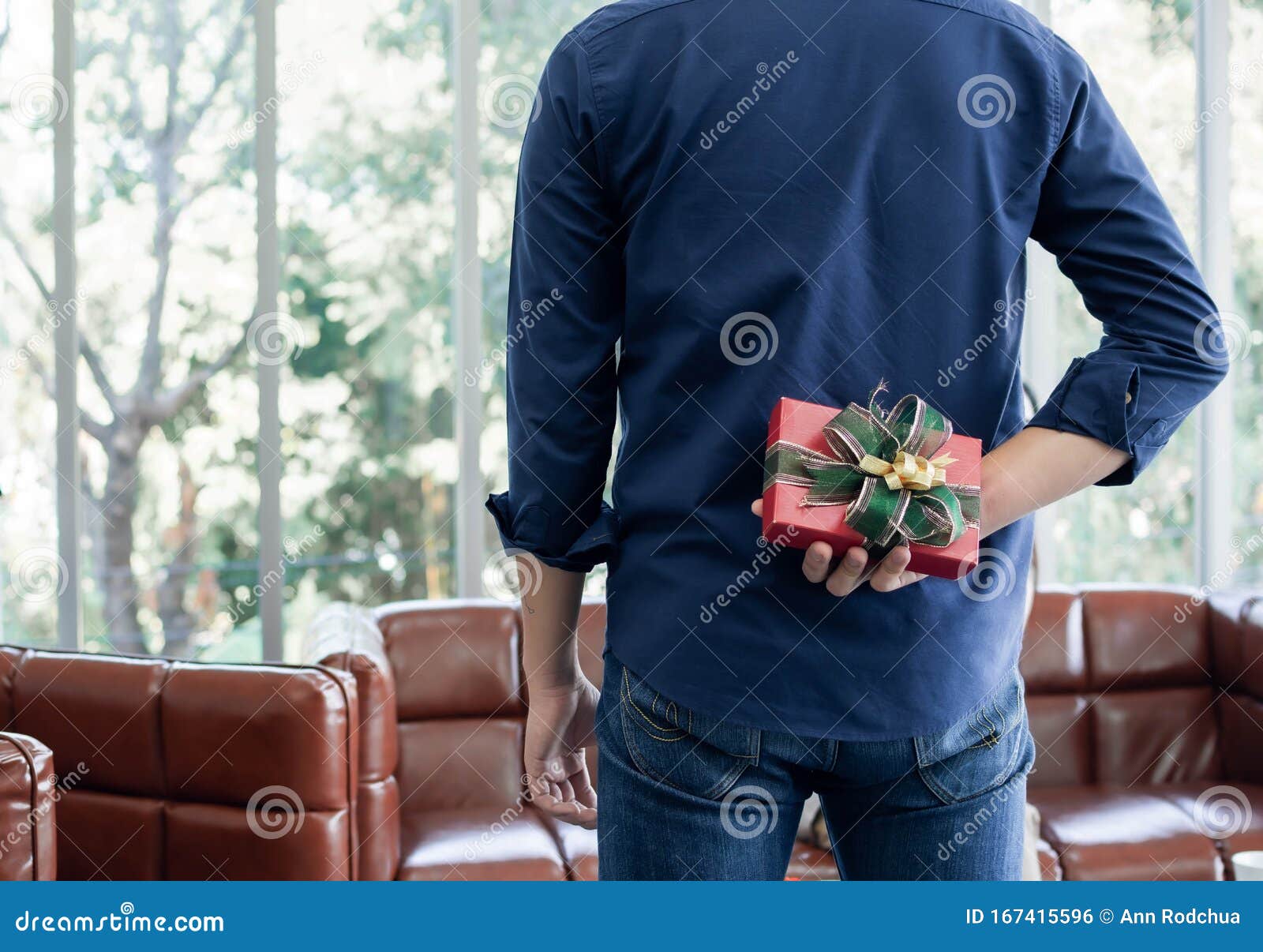 A Man is Hiding Gift for Surprising Stock Photo - Image of holiday ...