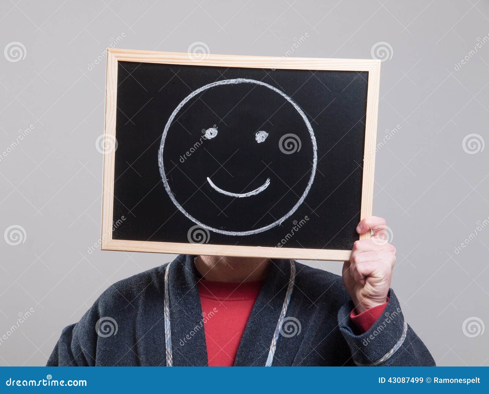 Man Hiding His Face with a Billboard with a Smiley Face Stock Image ...