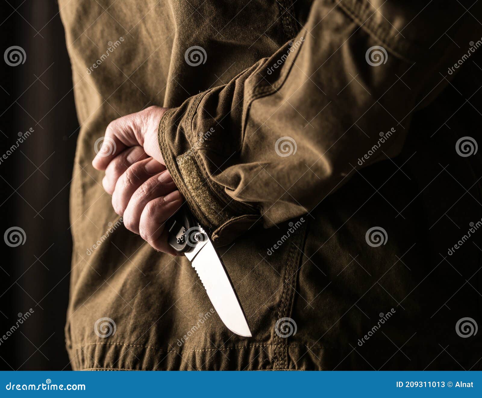 Man Holding a Knife Behind His Back Stock Image - Image of weapon ...