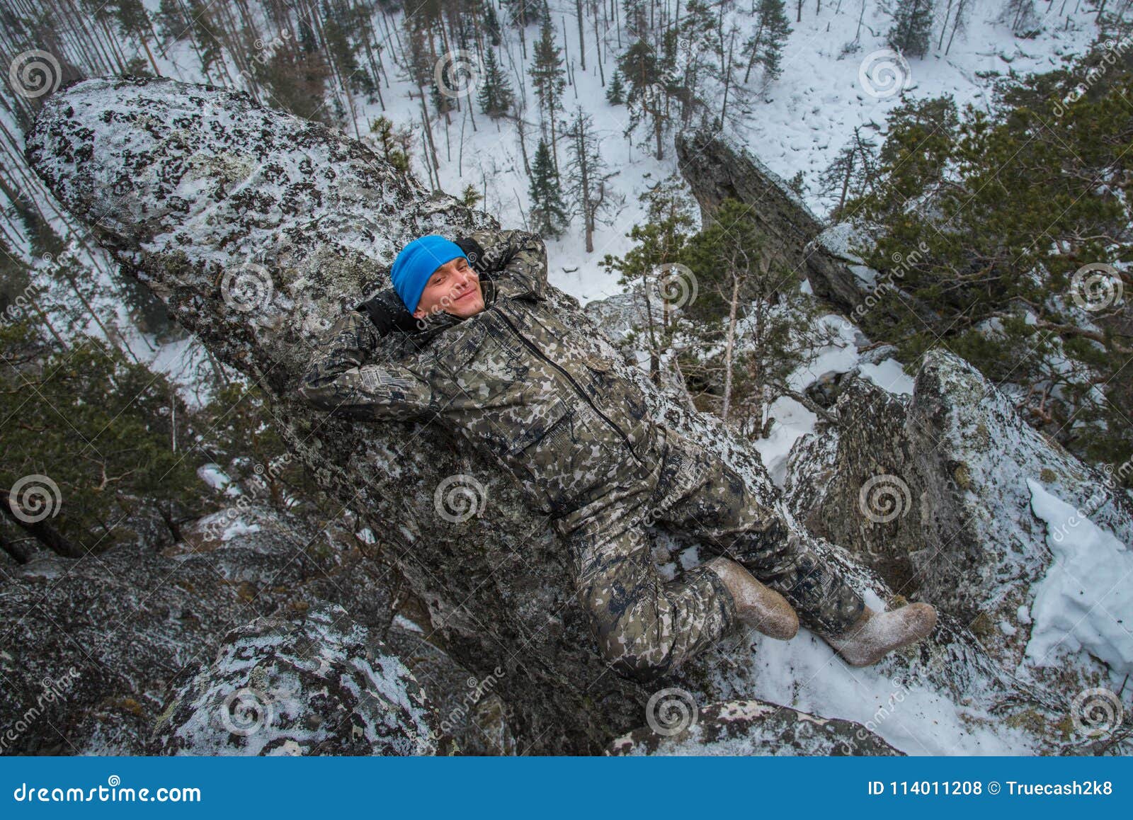 Man Hiker Have Rest at Mountain Top, Relax Lying on Rock. Stock Photo ...