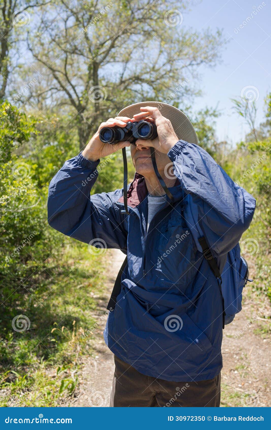 Man Hiking, Birdwatching and Looking through Binoc Stock Photo - Image ...