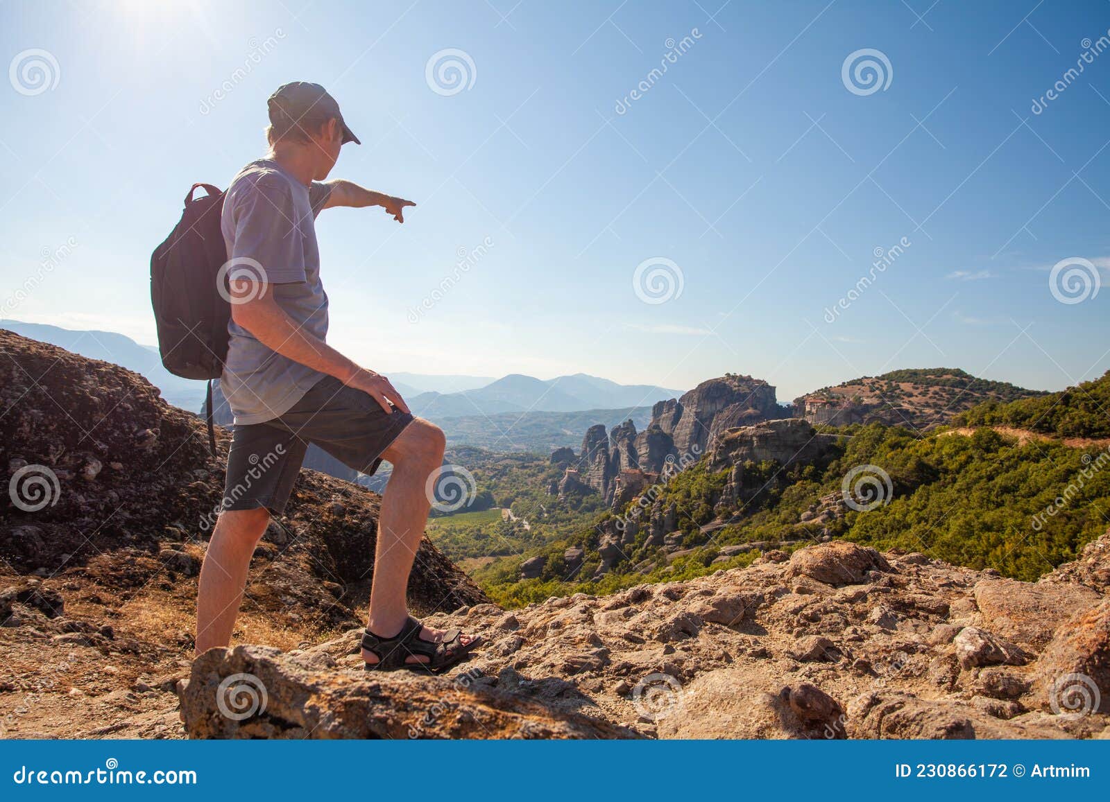 Man Hiking in Mountain and Pointing Hand Stock Photo - Image of meteora ...