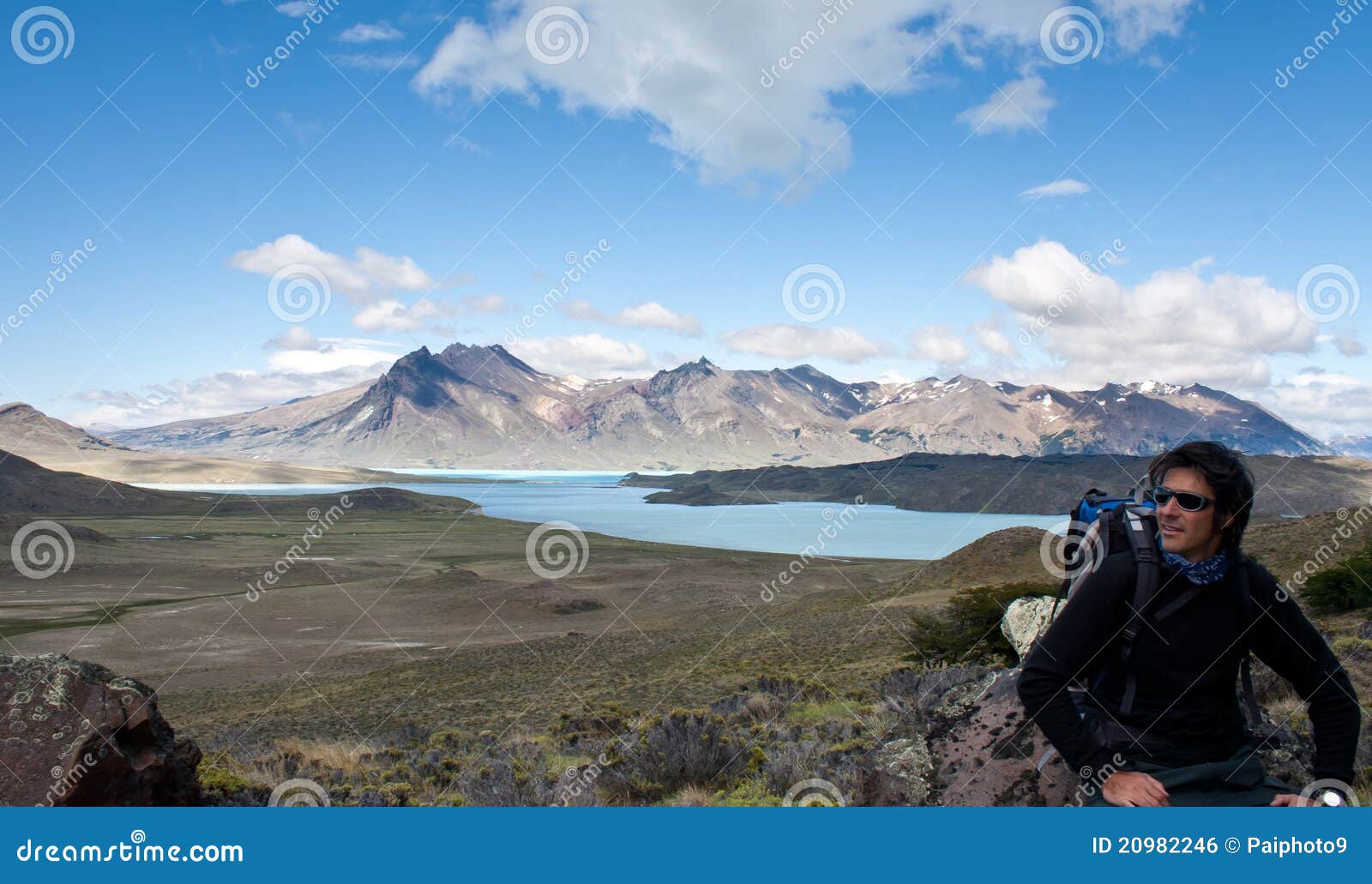 Man Hiking Rest Stop by Lake Stock Photo - Image of mountains, clothing ...