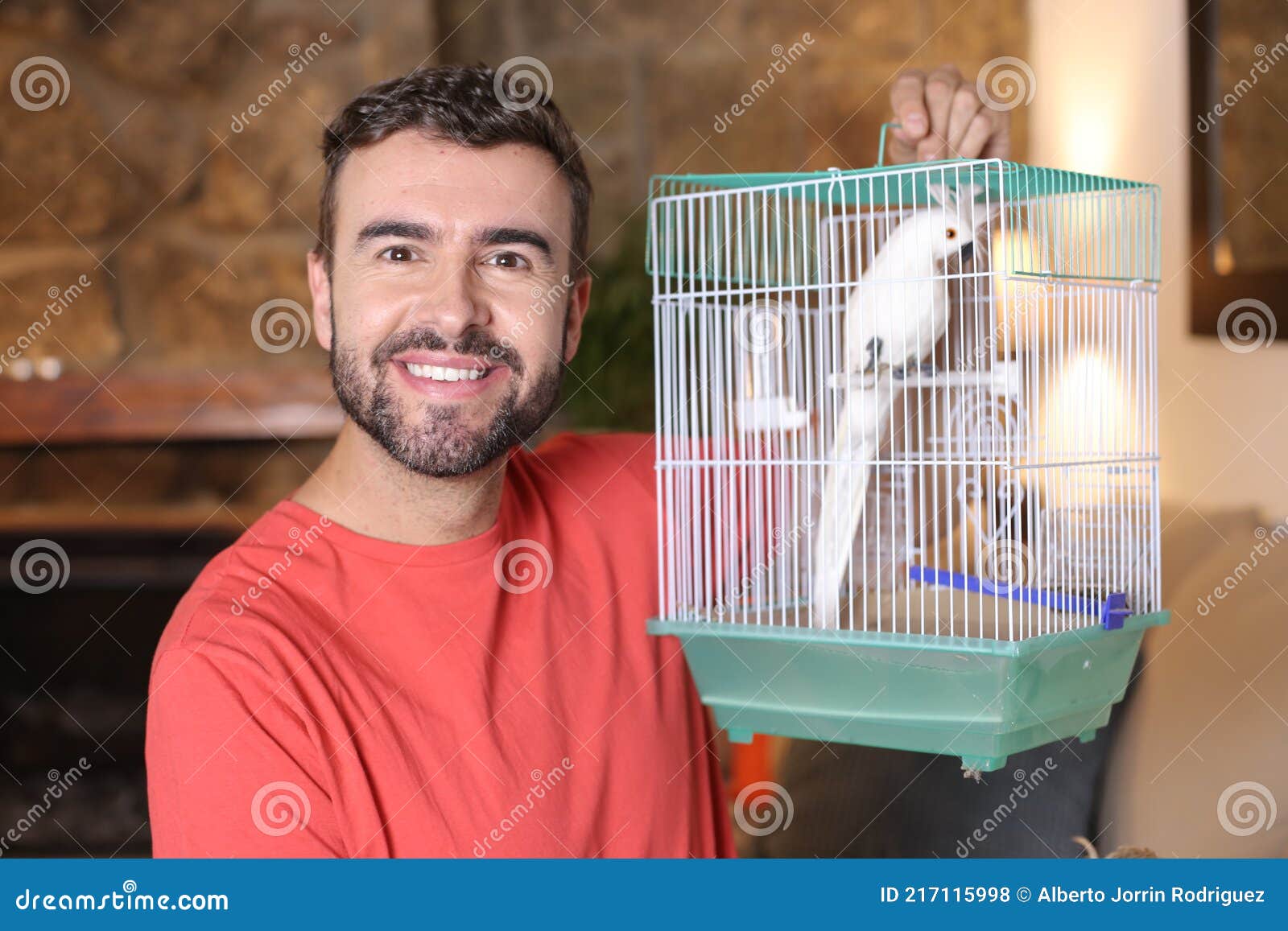 Man with his bird pet stock photo. Image of birding - 217115998