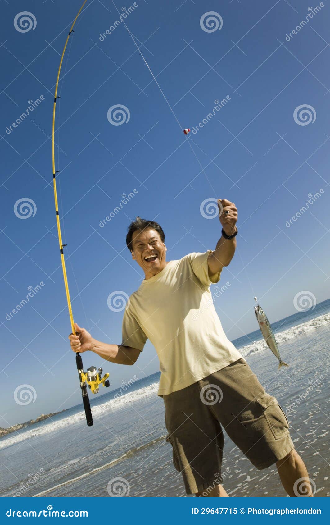 Man with His Catch on the Beach Stock Image - Image of outdoors, pride ...