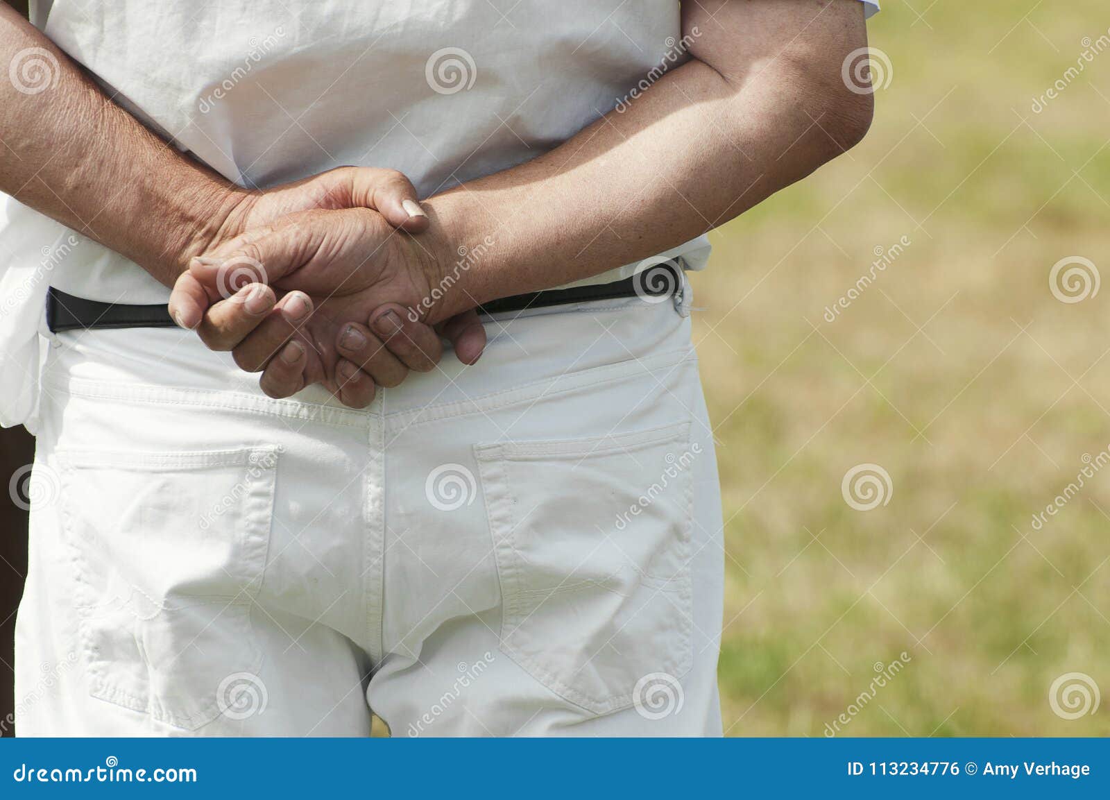 Man with His Hands on His Back Stock Photo - Image of corporate ...