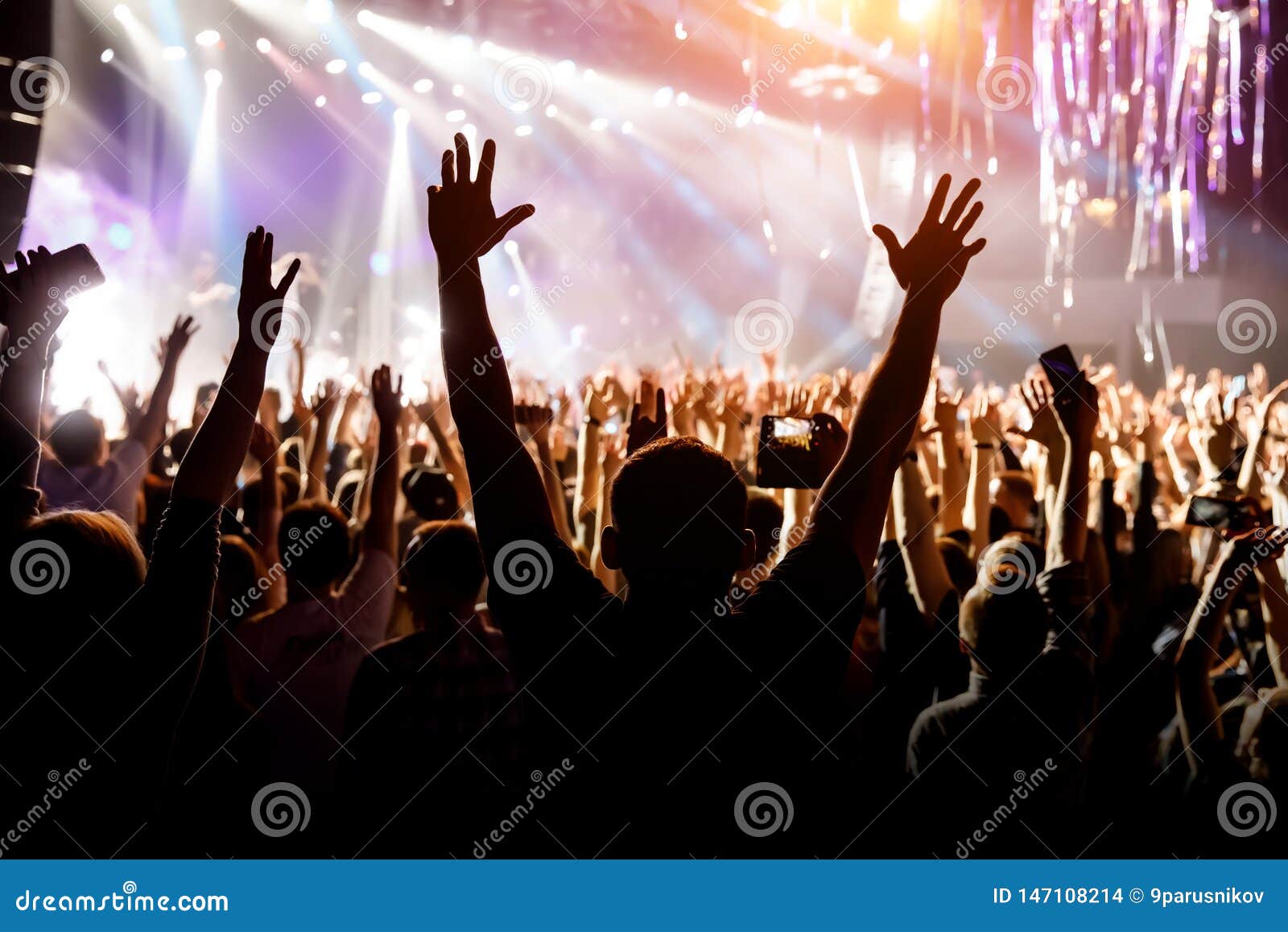 A Man with His Hands Up at a Concert of His Favorite Group Stock Photo ... A Man with His Hands Up at a Concert of His Favorite Group Stock Photo ...