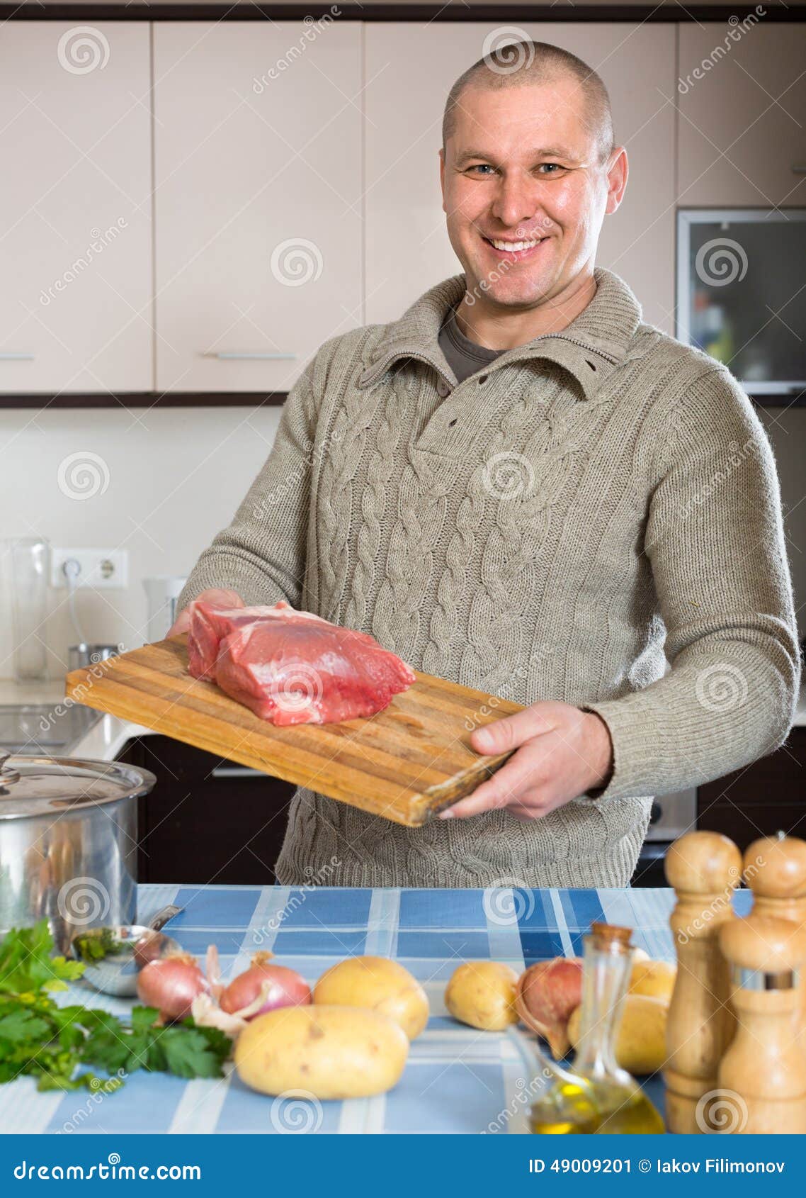 Man in his kitchen stock image. Image of holding, adult - 49009201