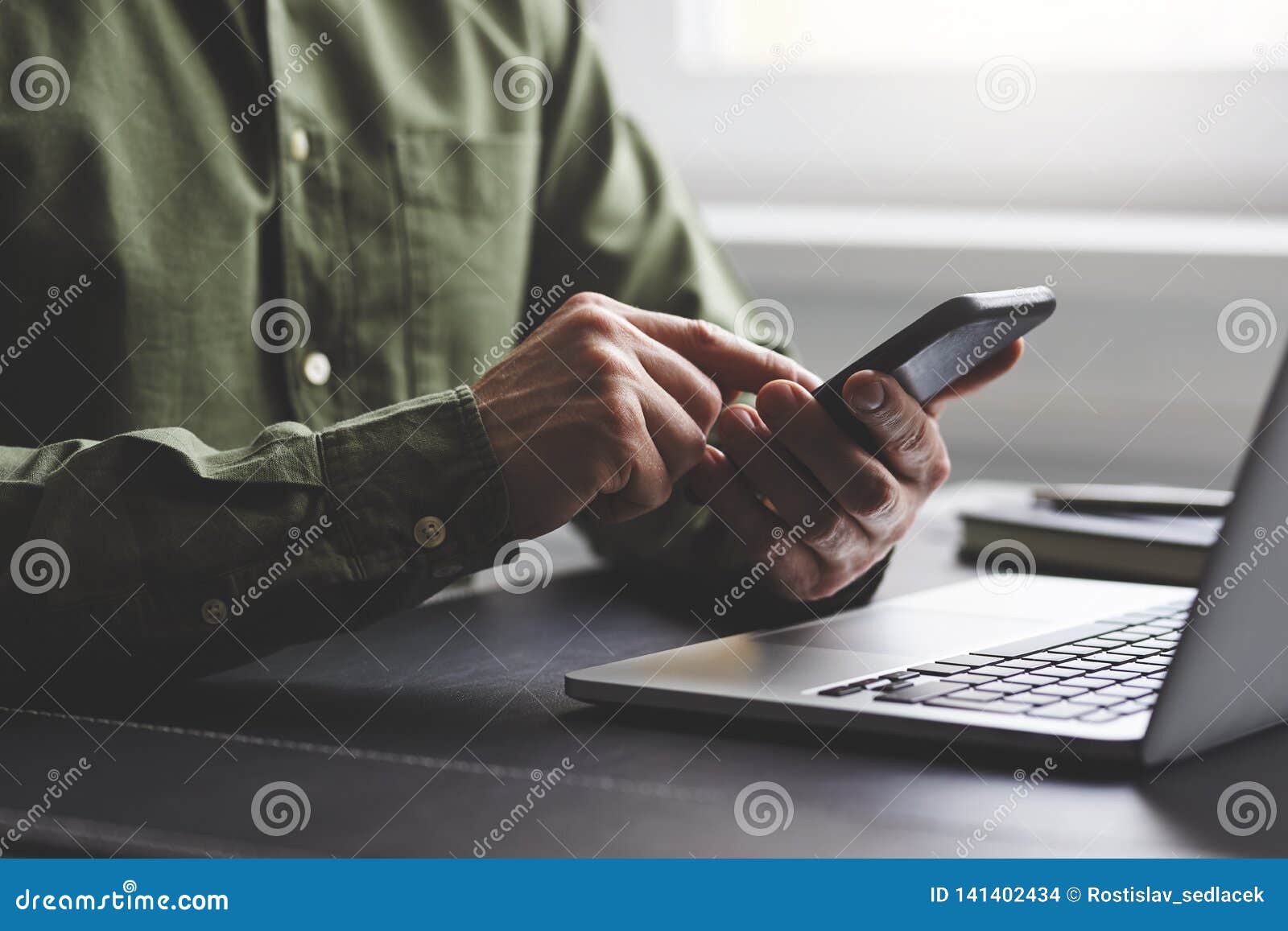 A Man with His Mobile Phone in the Office Stock Photo - Image of ...