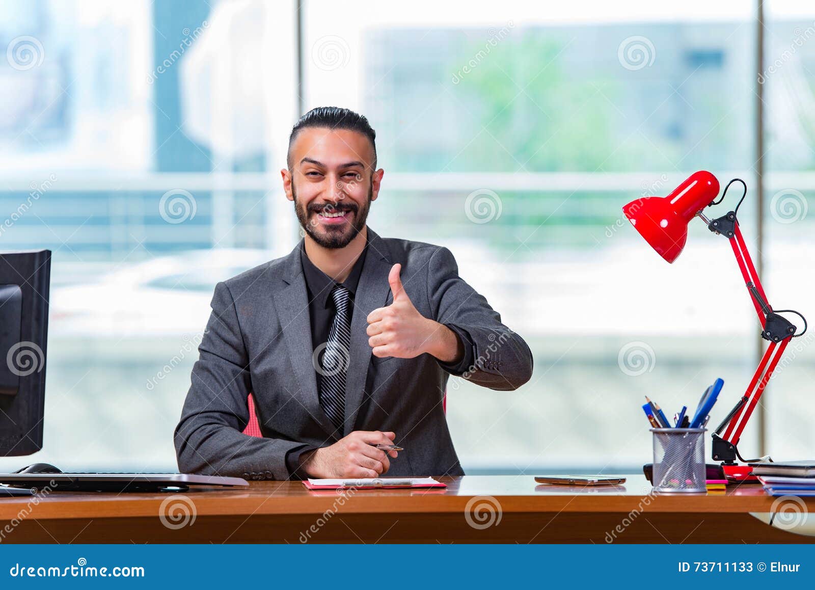 The Man with His Thumbs Up in the Office Desk Stock Image - Image of ...
