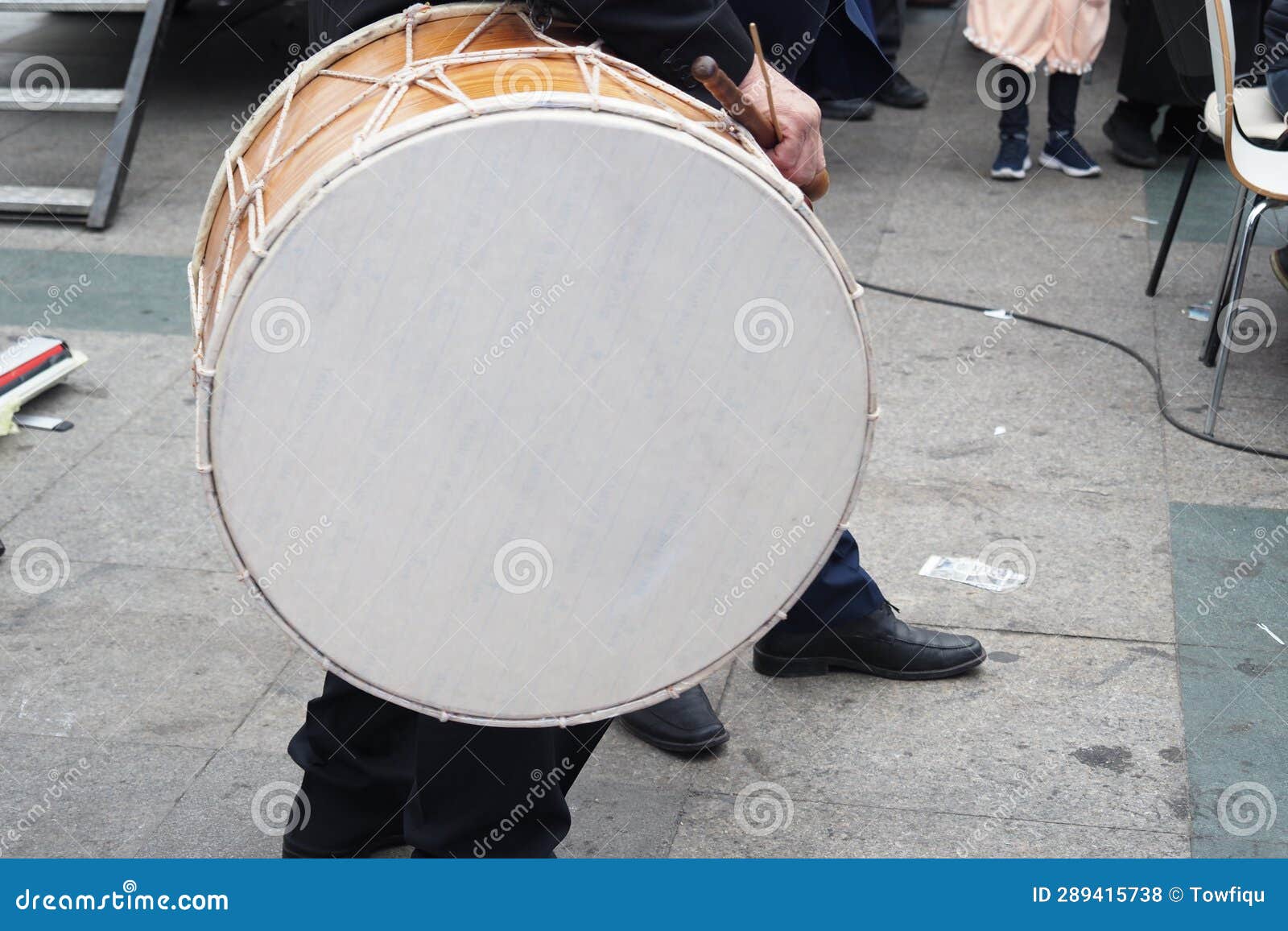 A Man Hit the Ancient Drum with Musical Instrument. Stock Photo - Image ...