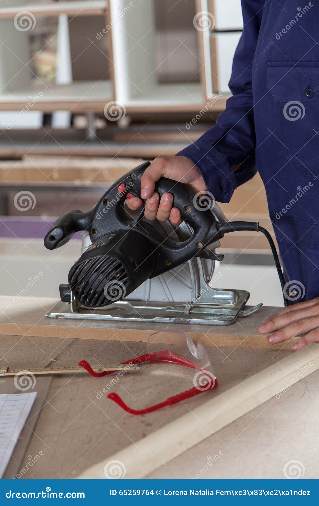 Man hoding an electric saw stock photo. Image of adult - 65259764