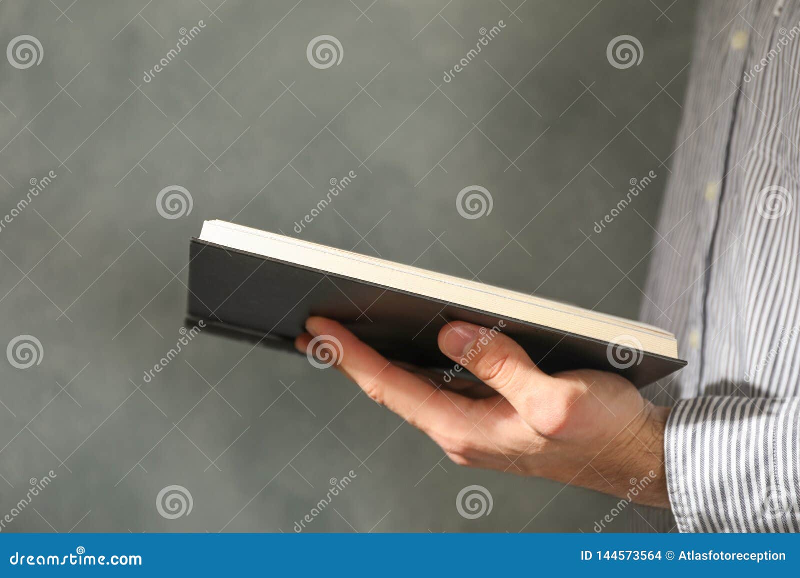 Man hold book in hands stock photo. Image of prayer - 144573564