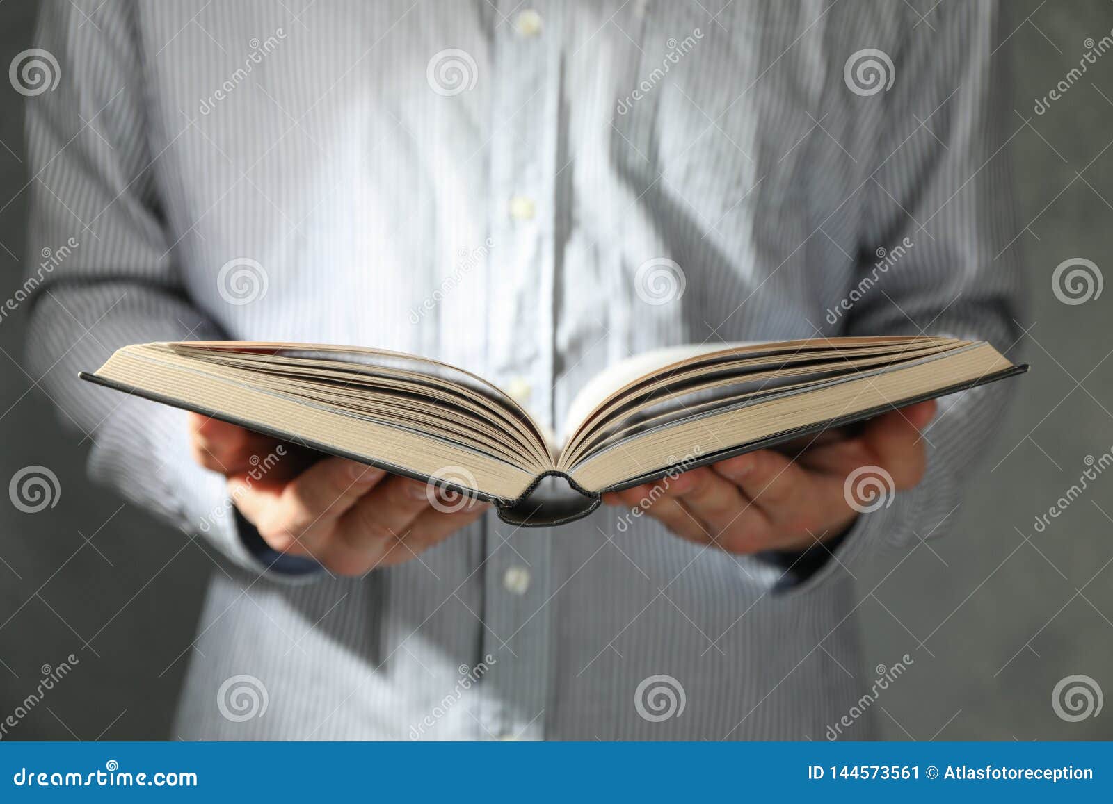 Man hold book in hands stock image. Image of arab, quran - 144573561