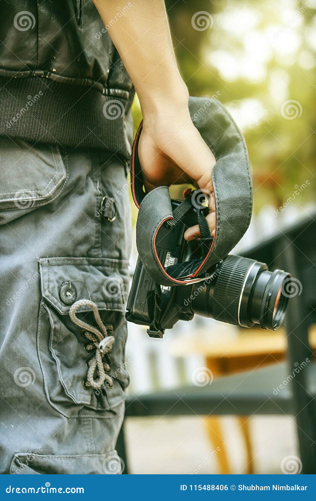 Man Hold the Camera into Hand Stock Photo - Image of hold, hand: 115488406