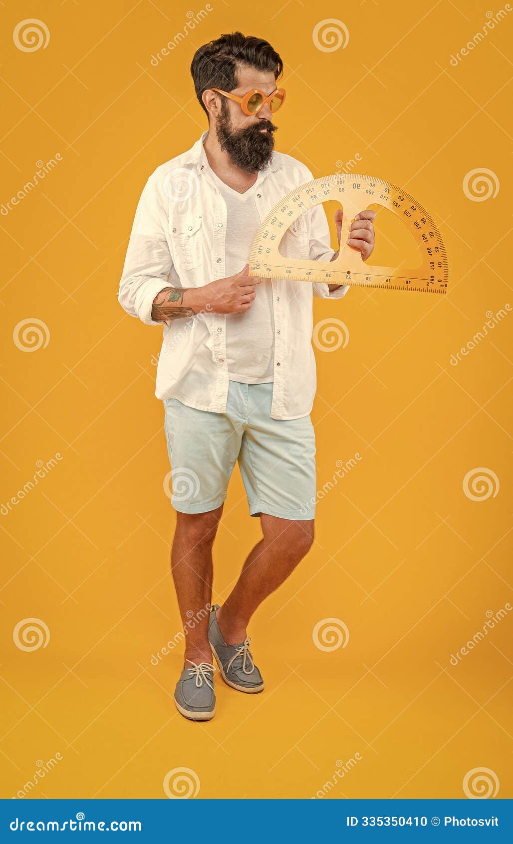 Man Hold Geometry Protractor Isolated on Yellow. Man Hold Geometry ...