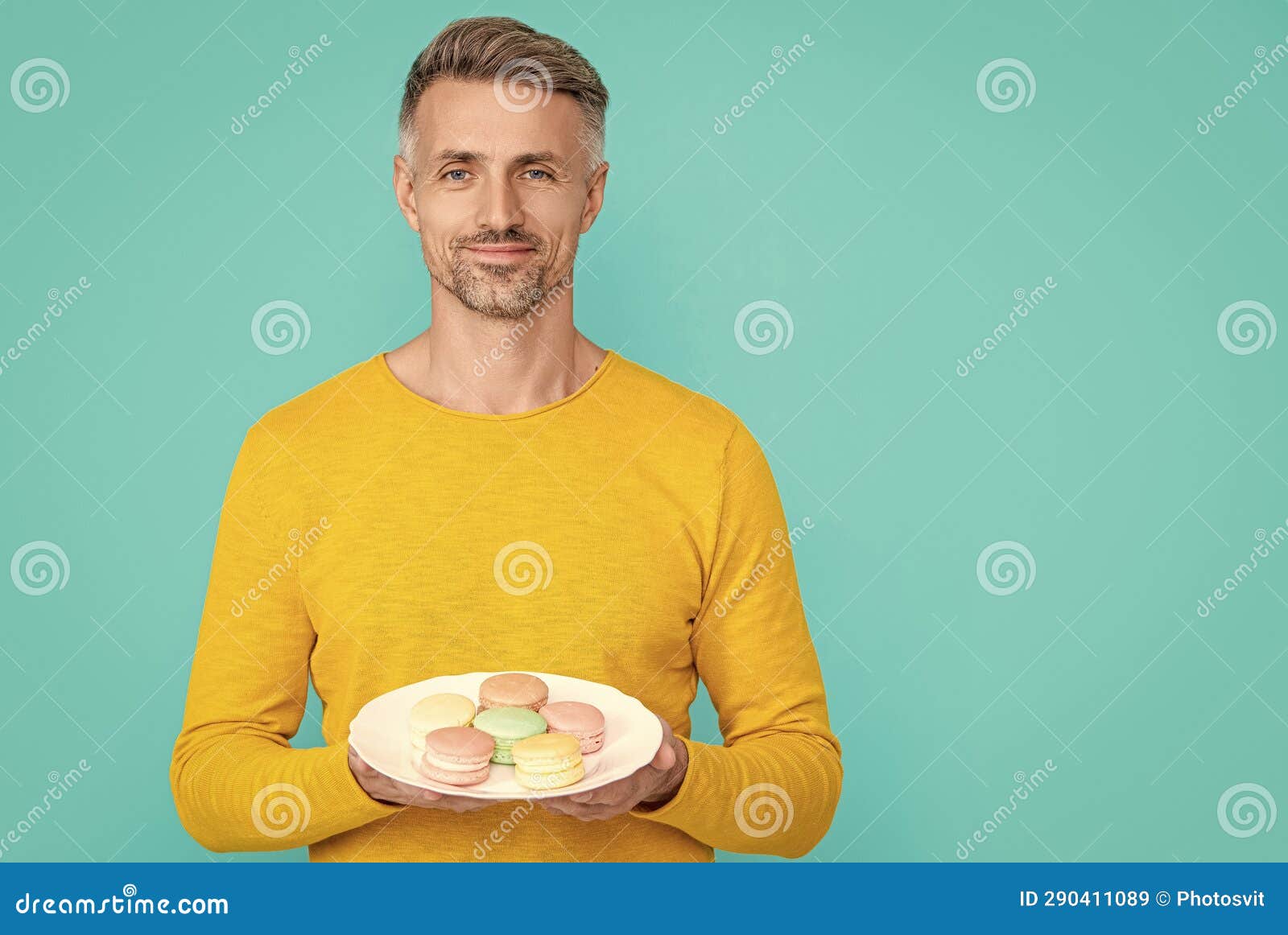 Man Hold Yummy Macaroon Isolated on Blue, Copy Space. Man Hold Yummy ...