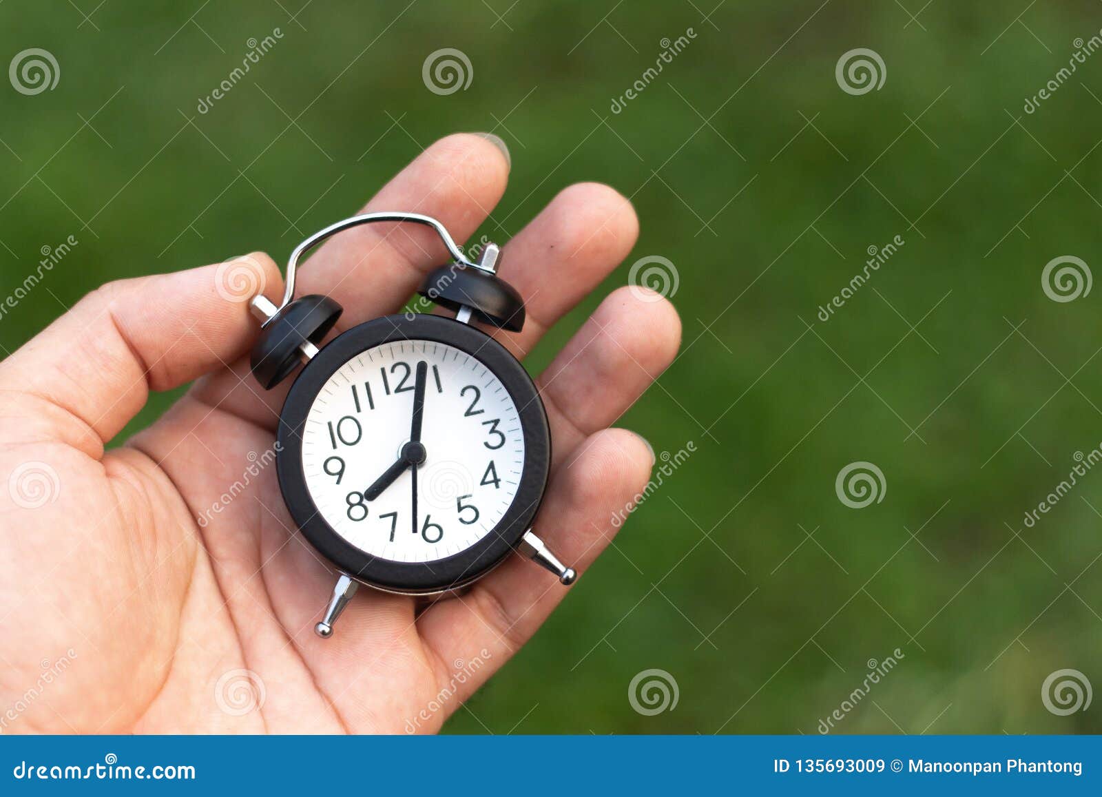 Man Holding an Alarm Clock in Hands Stock Image - Image of holding ...