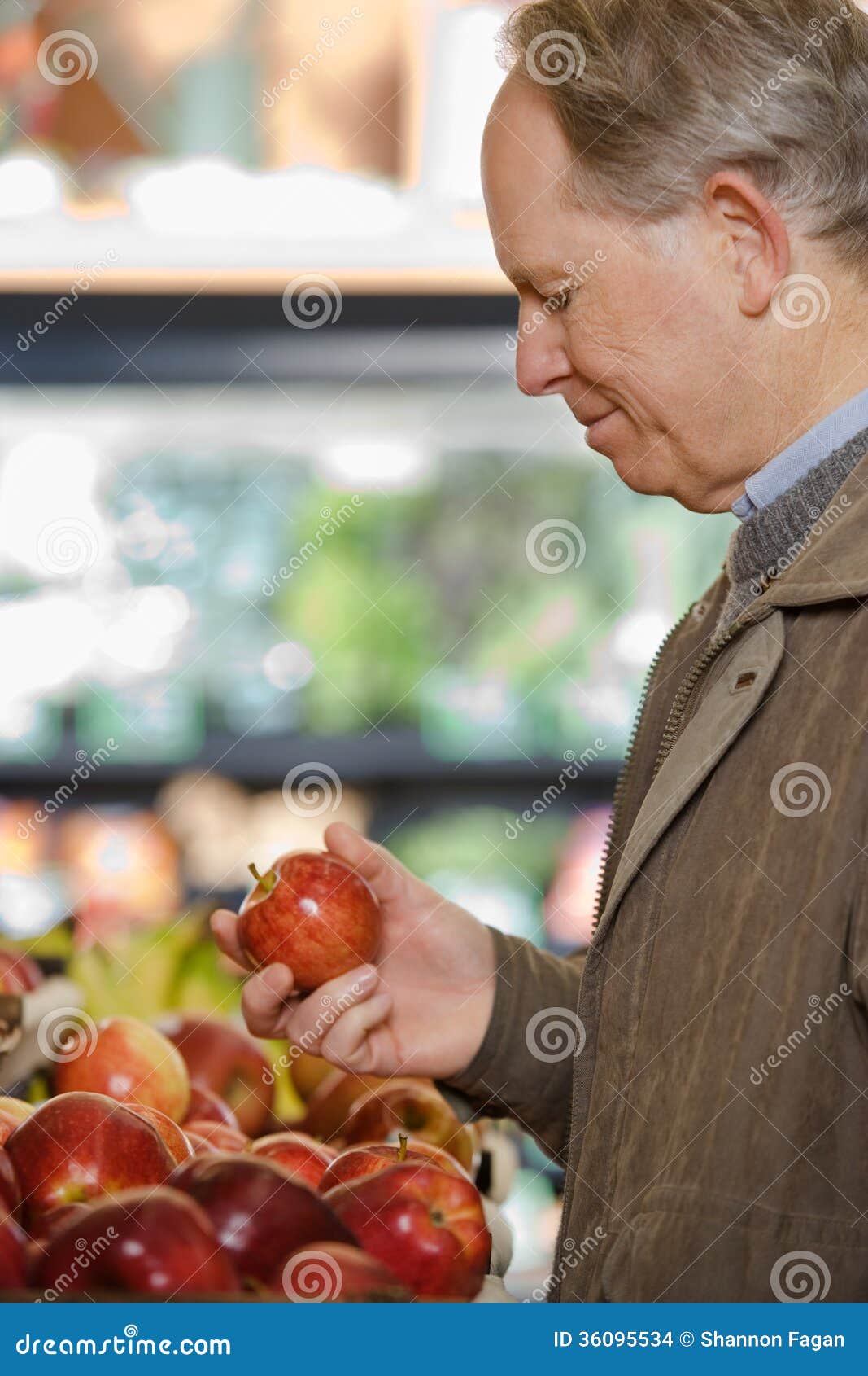 A man holding an apple stock photo. Image of appearance - 36095534