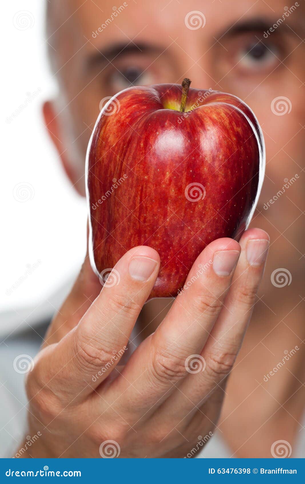 Man holding an apple stock photo. Image of adam, face - 63476398