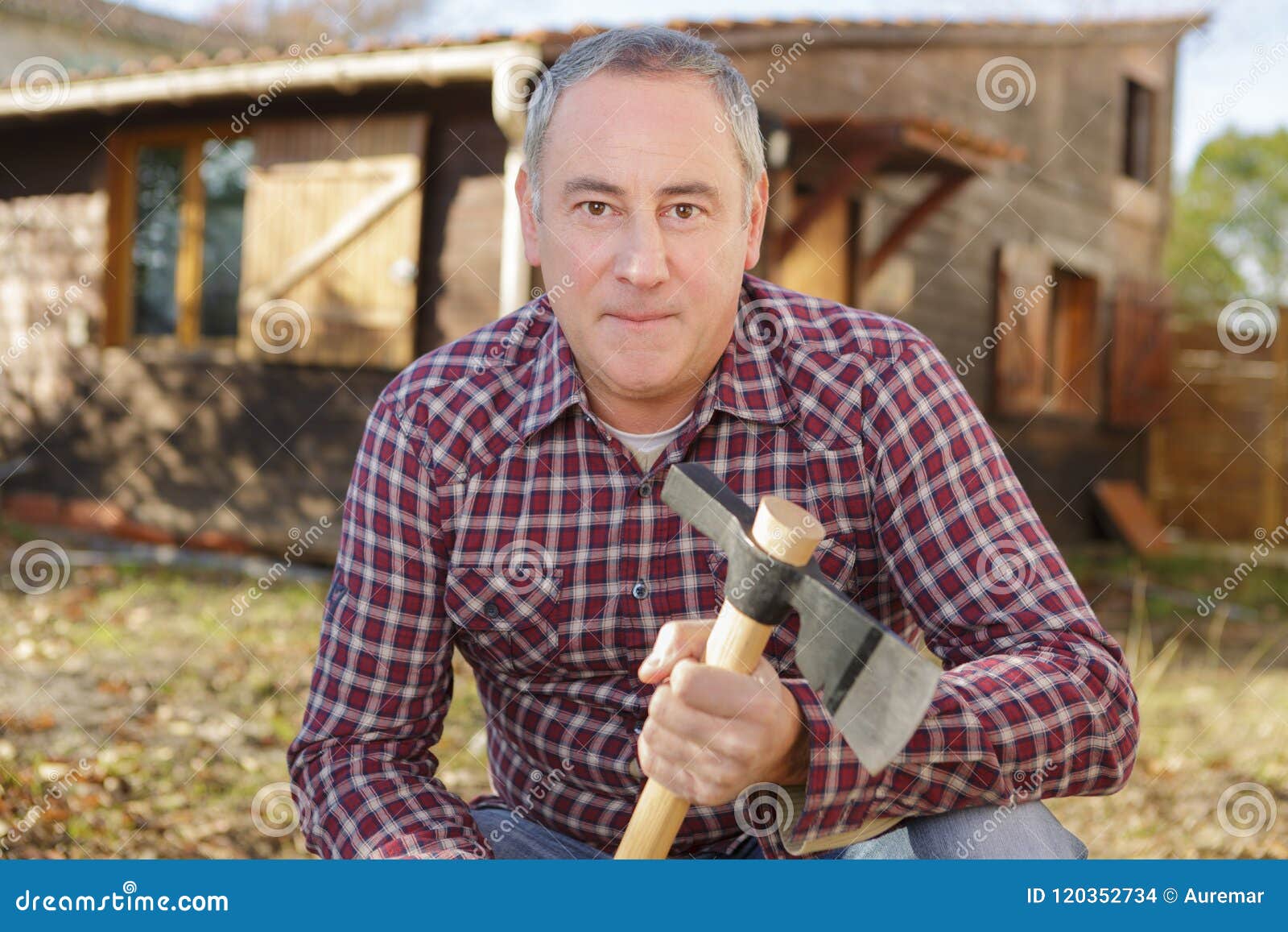 Man holding axe in garden stock photo. Image of clear - 120352734