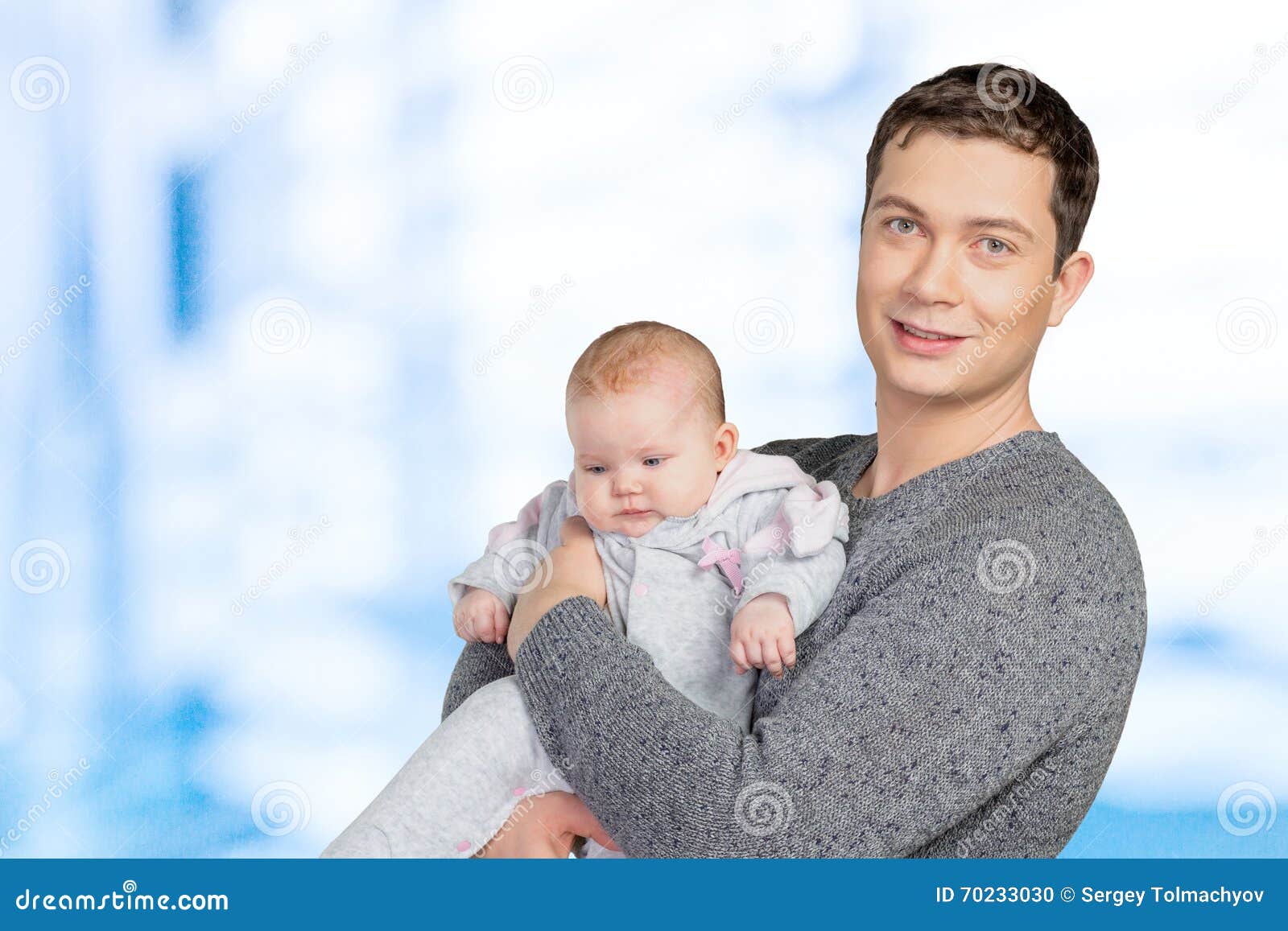 Man holding a baby stock photo. Image of fatherhood, father - 70233030